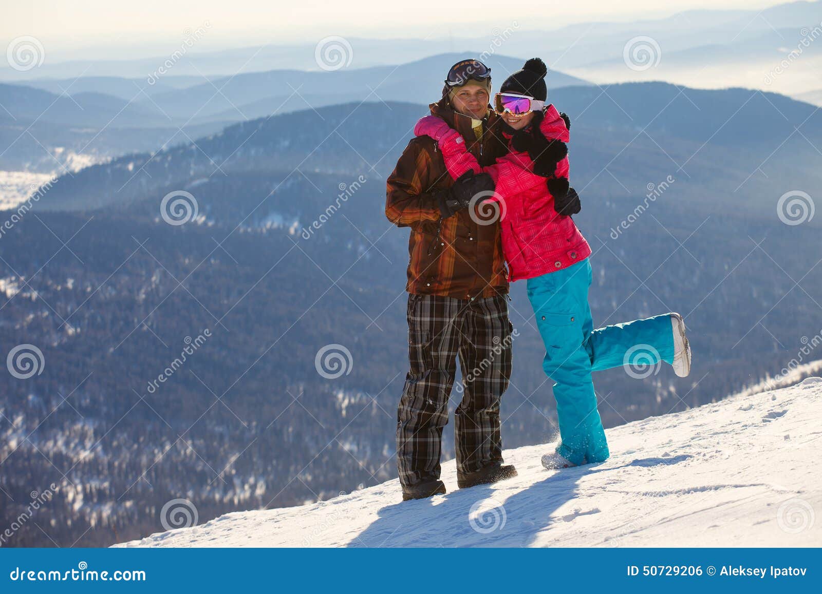 Happy snowboarding couple stock photo. Image of boys - 50729206
