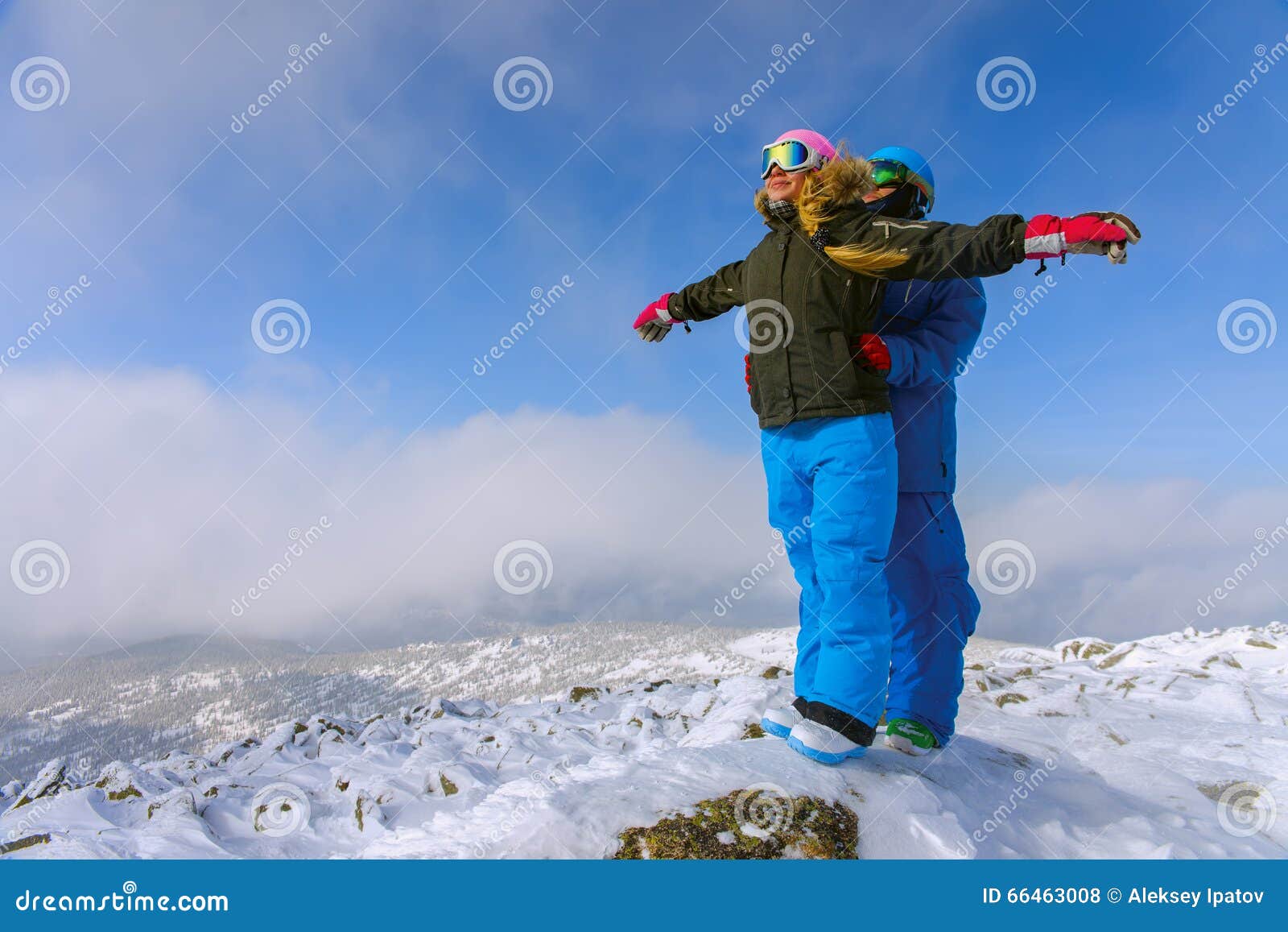 Happy snowboarding couple stock photo. Image of planning - 66463008
