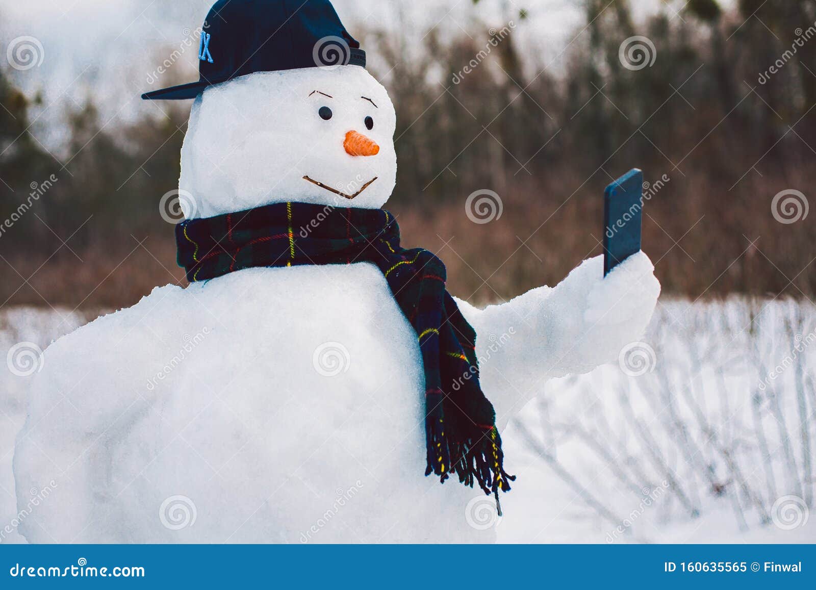 Snowman using smart phone stock image. Image of outdoors - 160635565