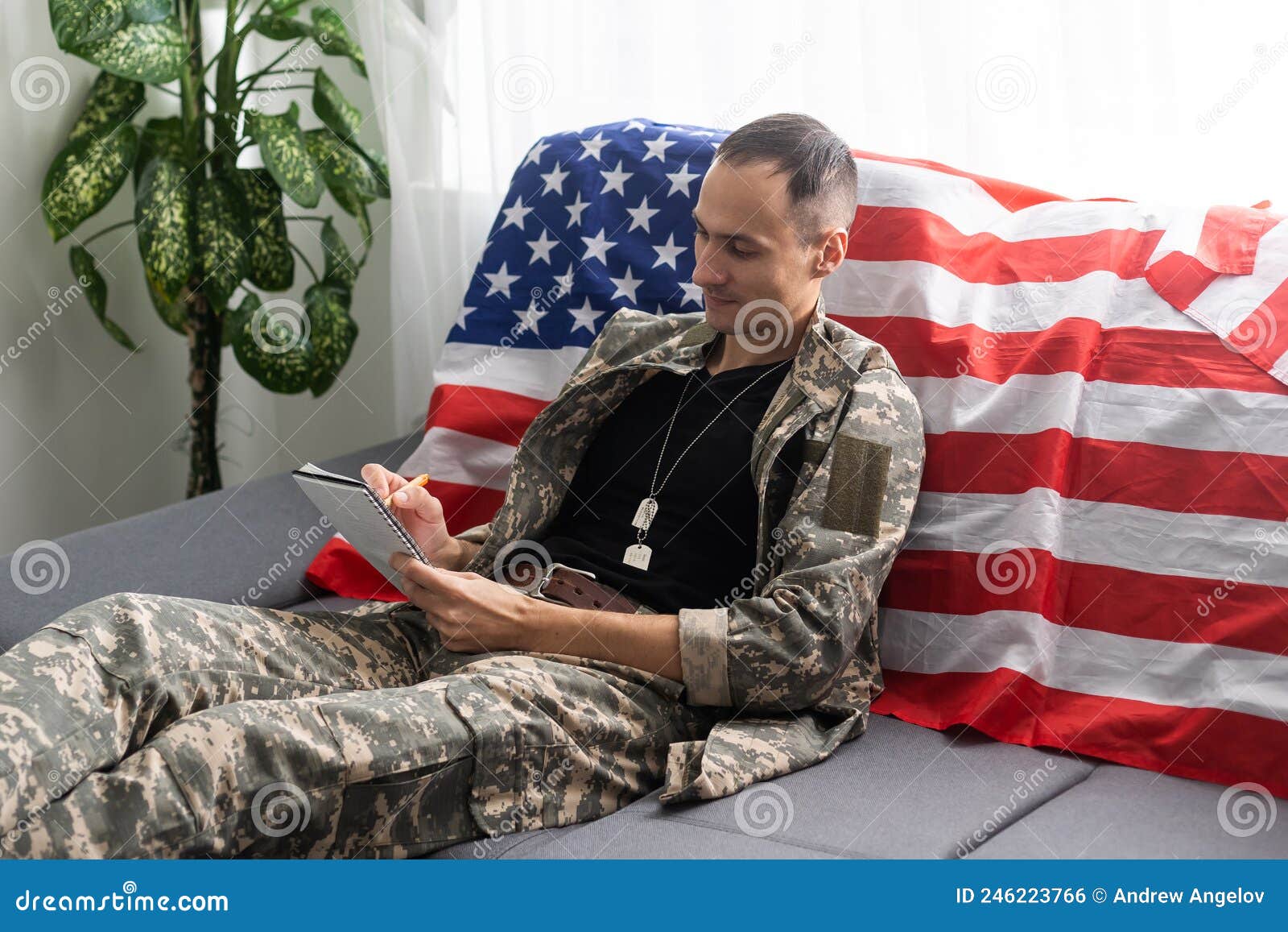 Happy Soldier Sitting on Table at Workplace and Writing in Documents ...
