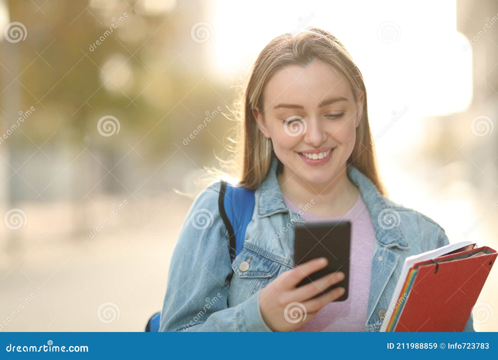 Happy Student Checking Smart Phone in the Street Stock Image - Image of ...
