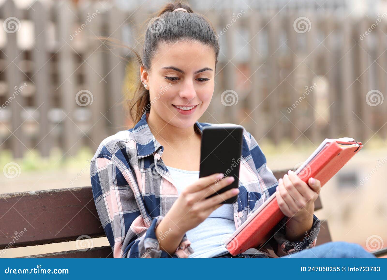 Happy Student Checking Smartphone in a Bench Stock Image - Image of ...