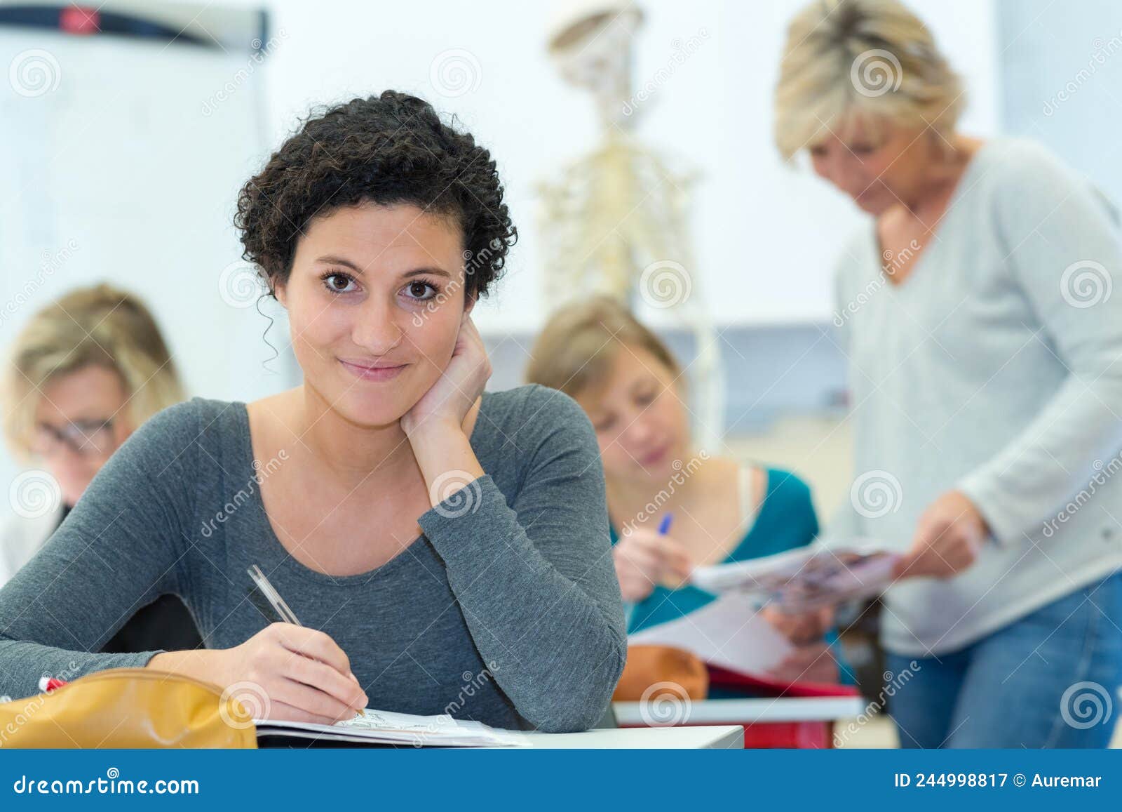Happy student in classroom stock image. Image of class - 244998817
