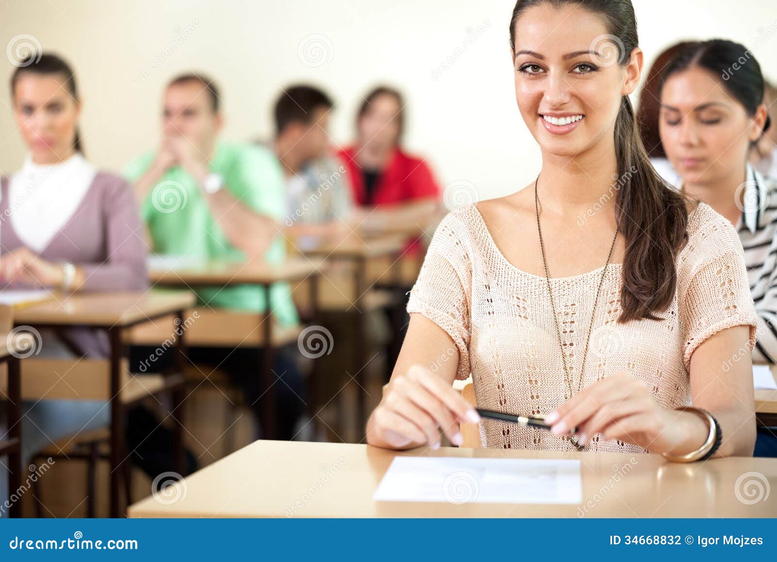 Happy student in classroom stock photo. Image of smiling - 34668832