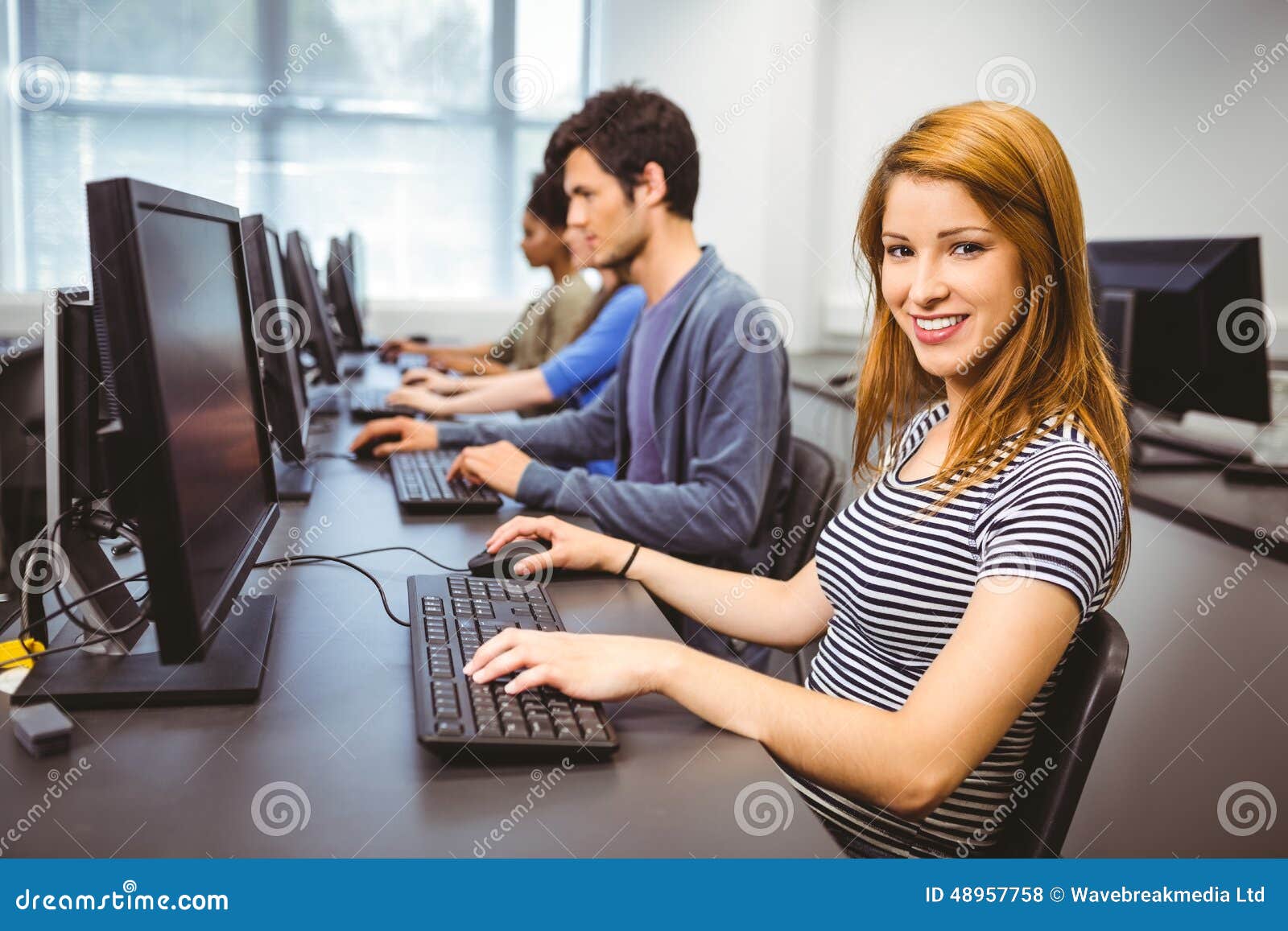 Happy Student in Computer Class Smiling at Camera Stock Photo - Image ...