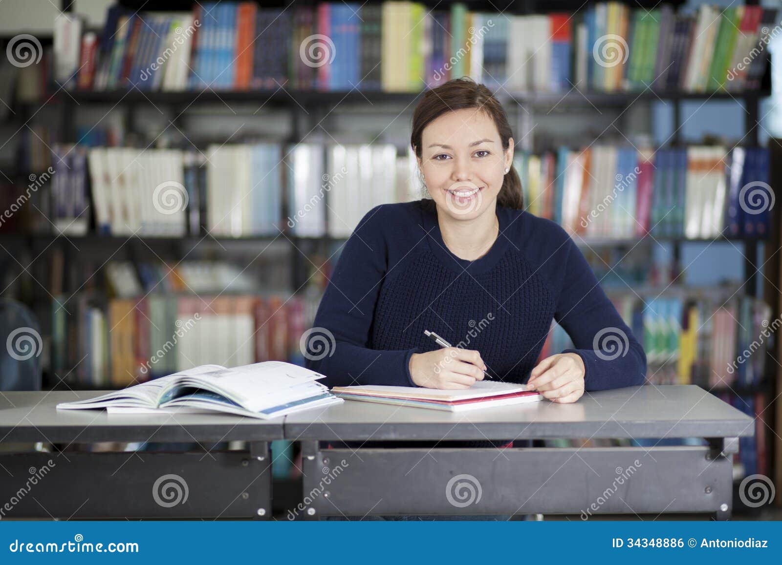 Happy Student Doing Homework Stock Photo - Image of female, young: 34348886