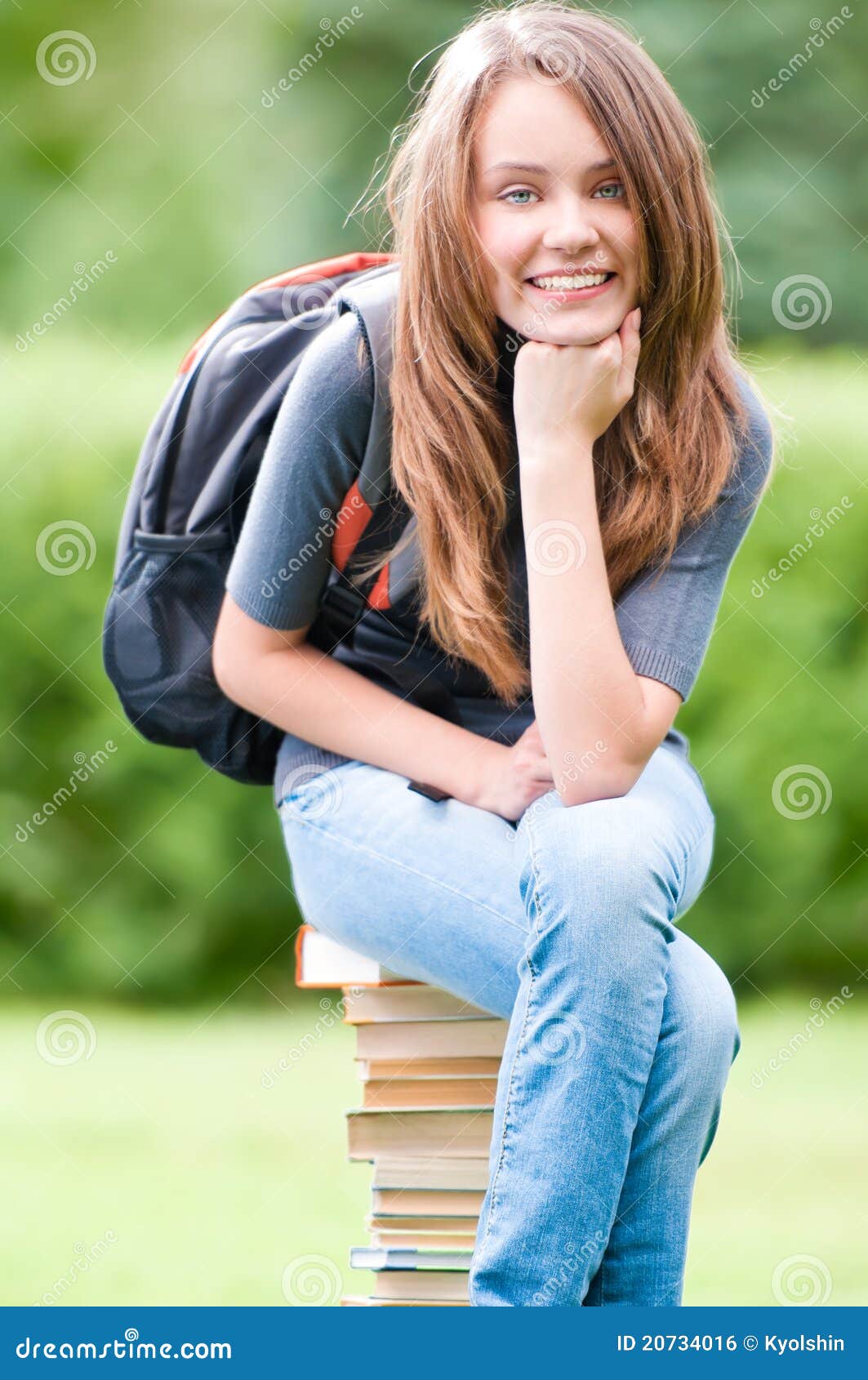 Happy Student Girl Sitting on Books Stock Photo - Image of blue, people ...