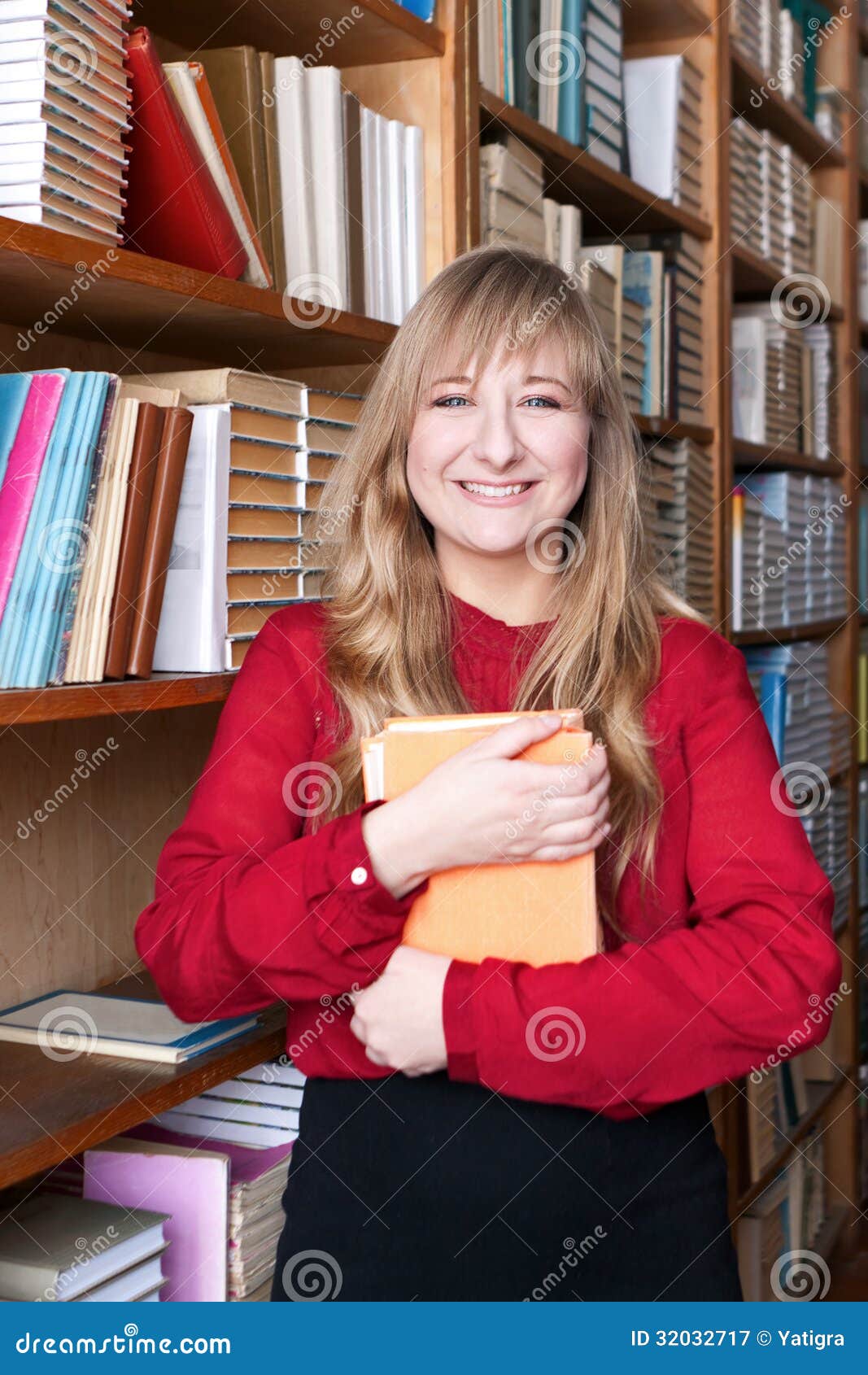 Happy Student Holding a Book Stock Image - Image of bookcase, college ...