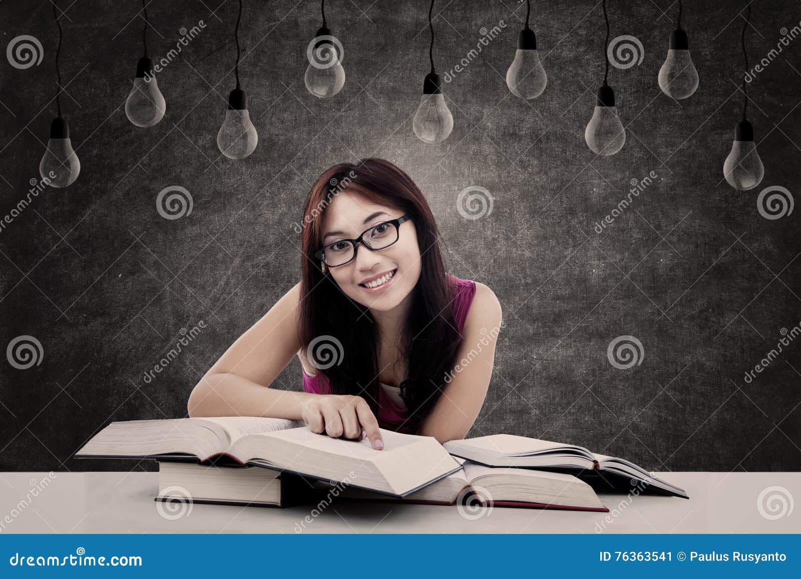 Happy Student Learning Under Light Bulbs Stock Image - Image of class ...