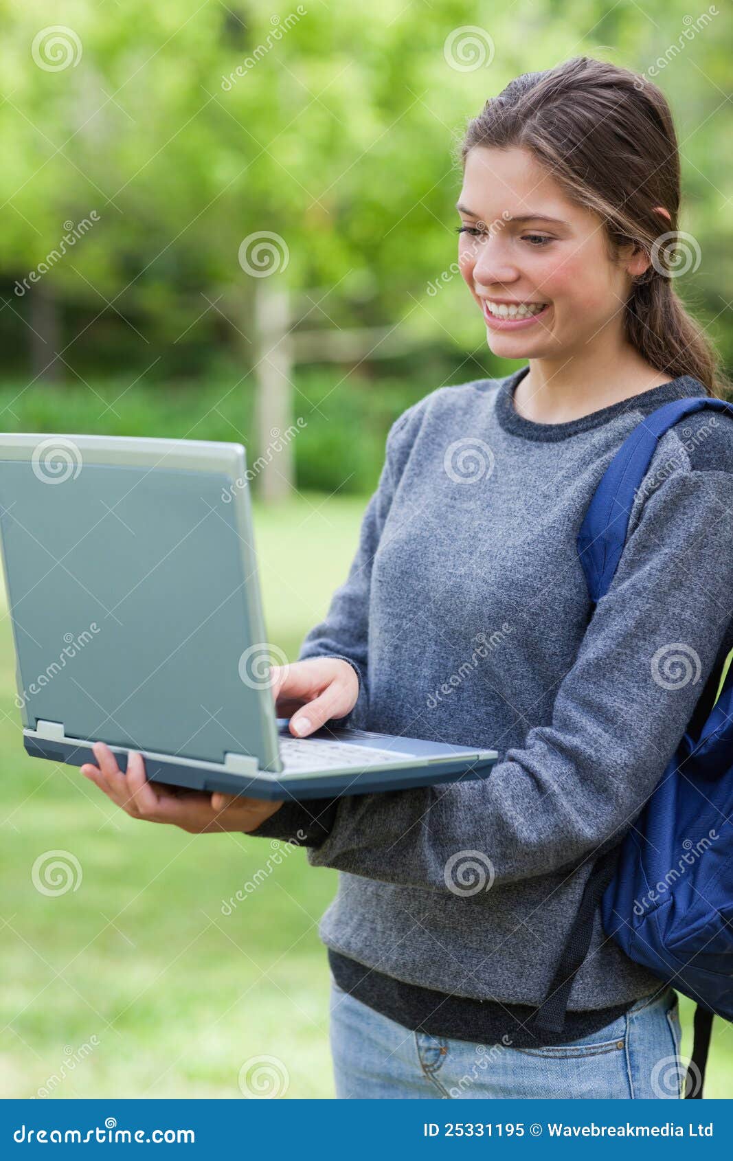 Happy Student Looking at the Screen of Her Laptop Stock Image - Image ...