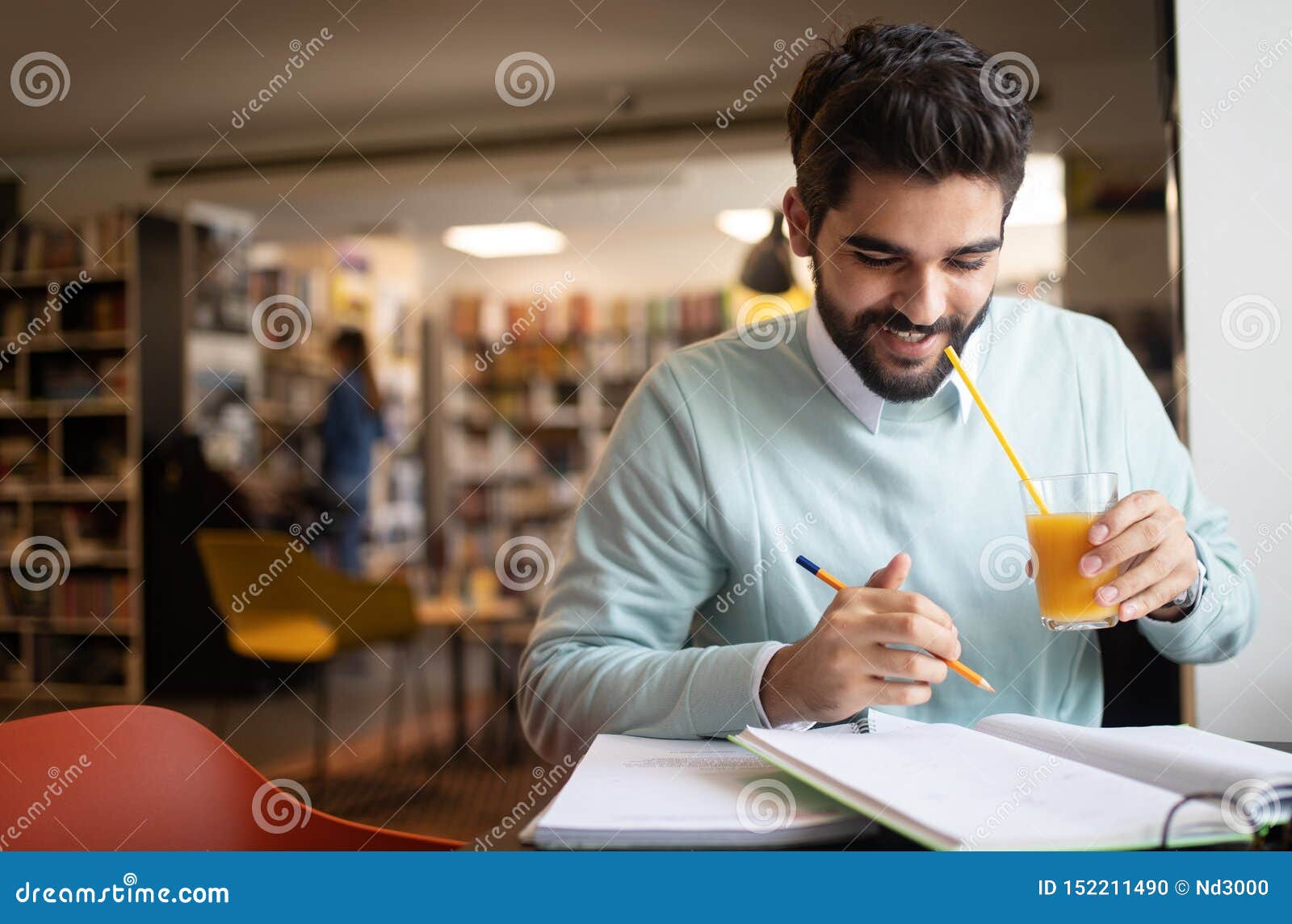 Happy Student Preparing Exam and Learning Lessons in College Library ...