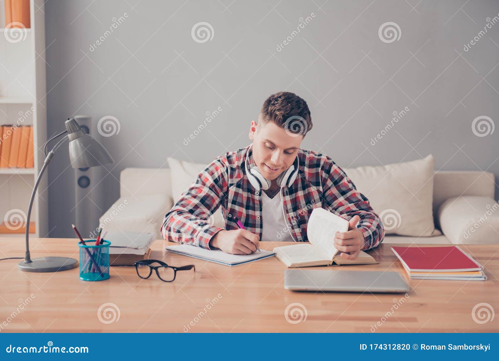 Happy Student Reading Book and Making Notes for Lecture Stock Photo ...