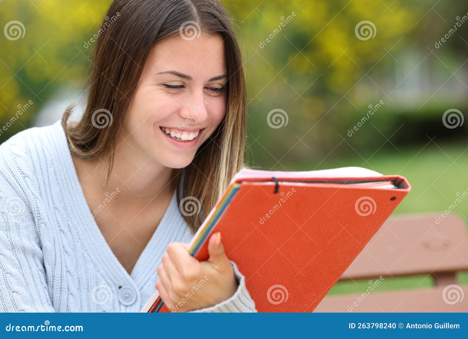 Happy Student Reading Notes in a Park Stock Photo - Image of alone ...