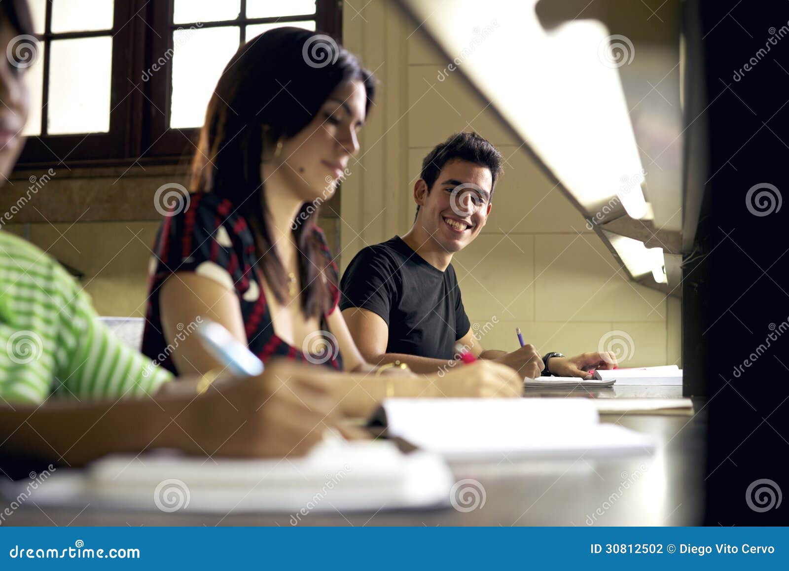 Happy Student Studying and Writing Stock Photo - Image of posing ...