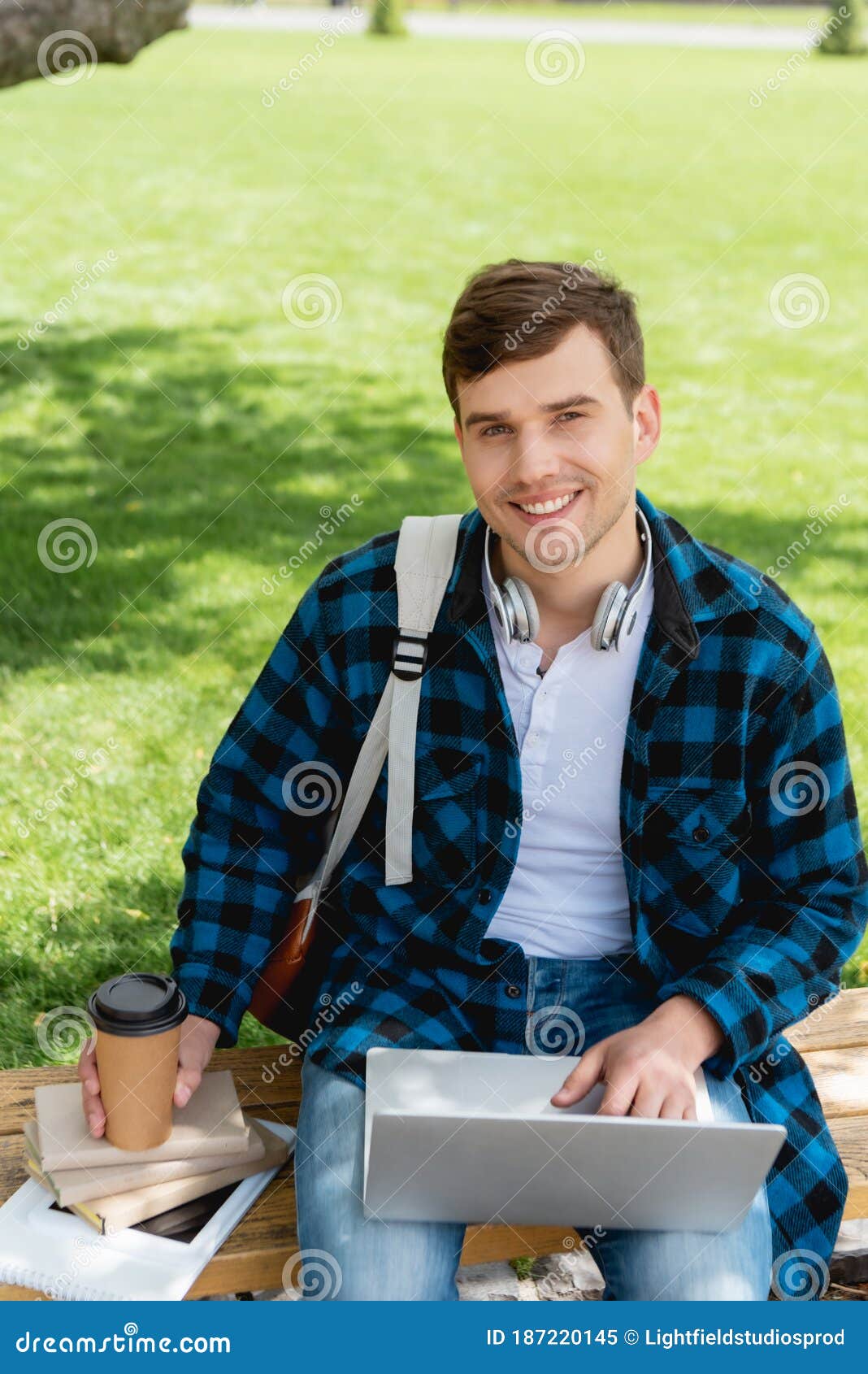 Student Using Laptop and Holding Paper Stock Image - Image of computer ...