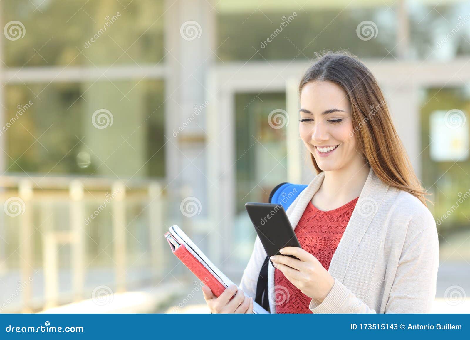 Happy Student Using Phone in a College Stock Image - Image of checking ...
