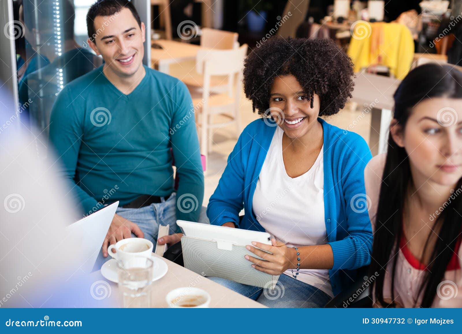 Happy students in cafe stock photo. Image of communication - 30947732
