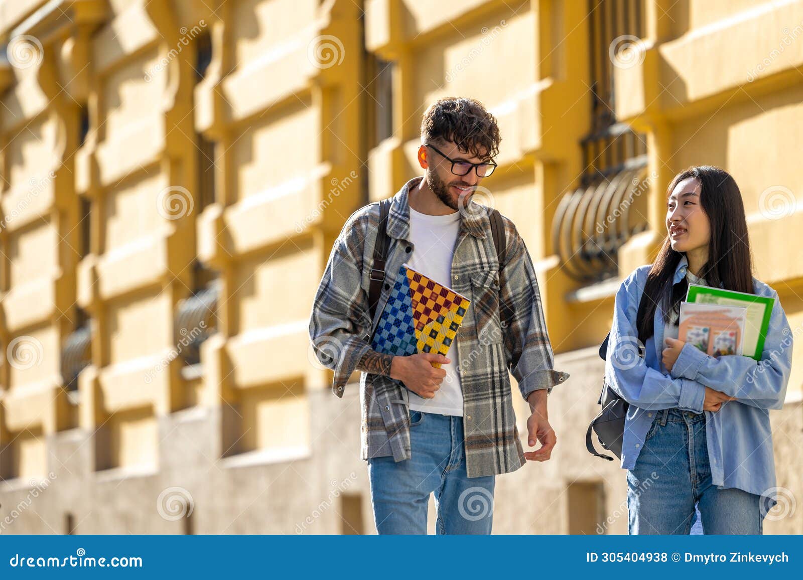 Happy Students Communicating while Walking through University Campus ...