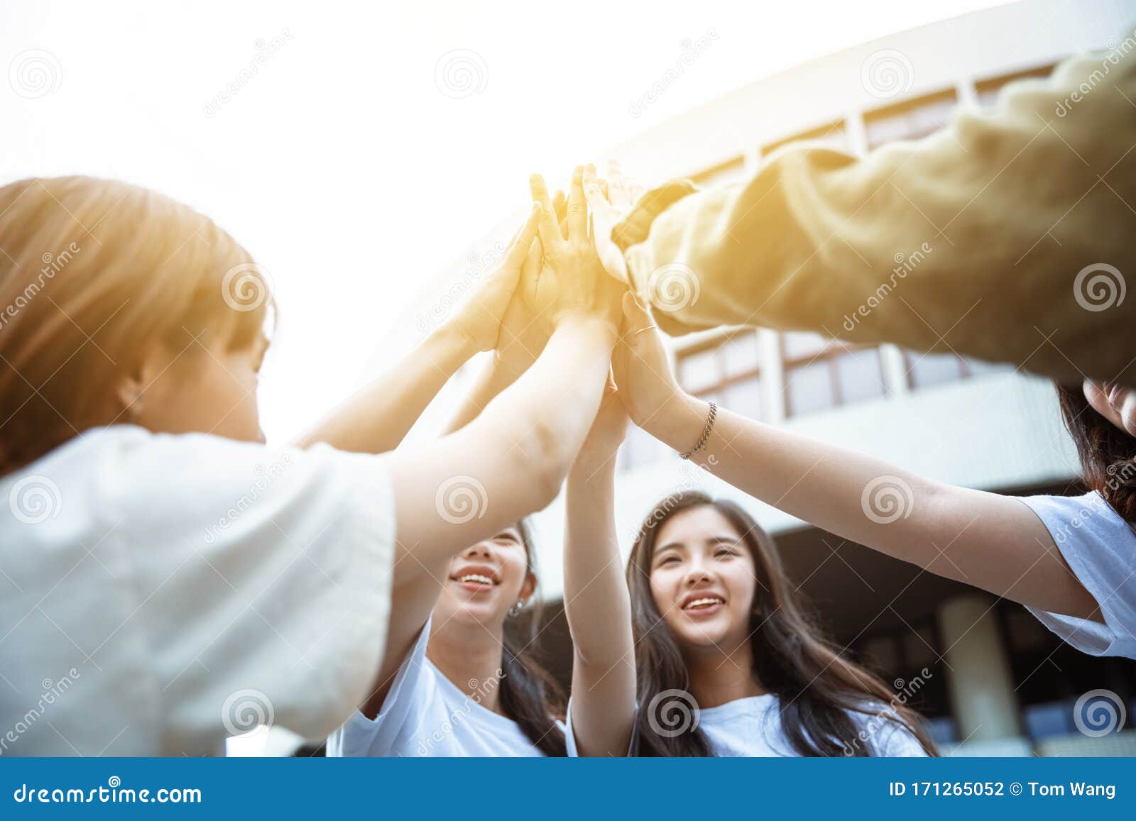 Happy Students Giving High Five at School Stock Photo - Image of casual ...
