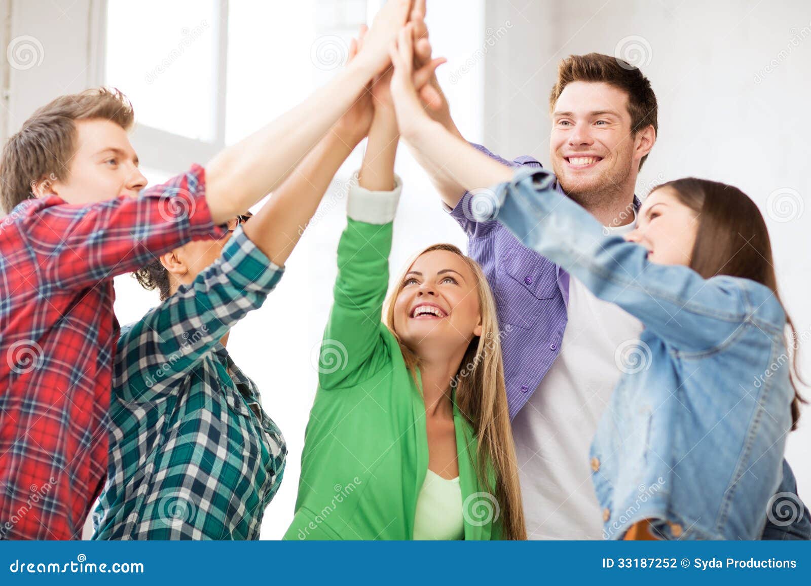 Happy Students Giving High Five at School Stock Photo - Image of ...