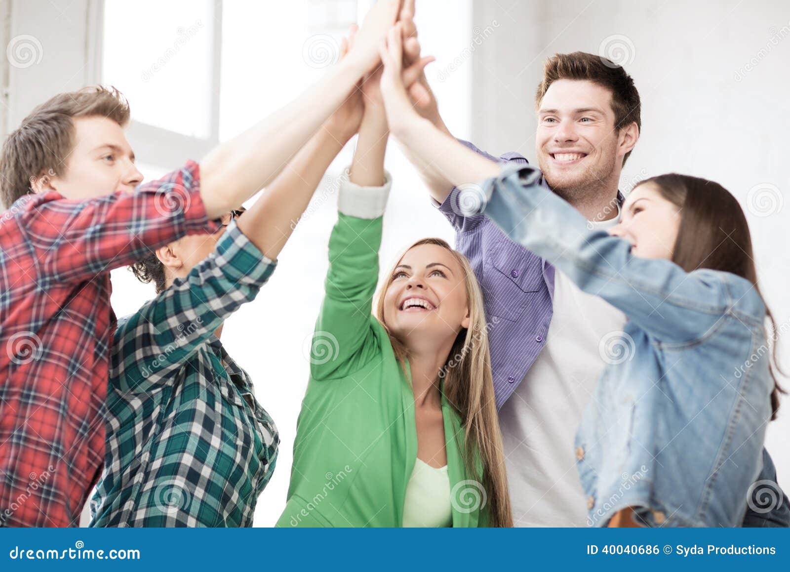 Happy Students Giving High Five at School Stock Photo - Image of ...