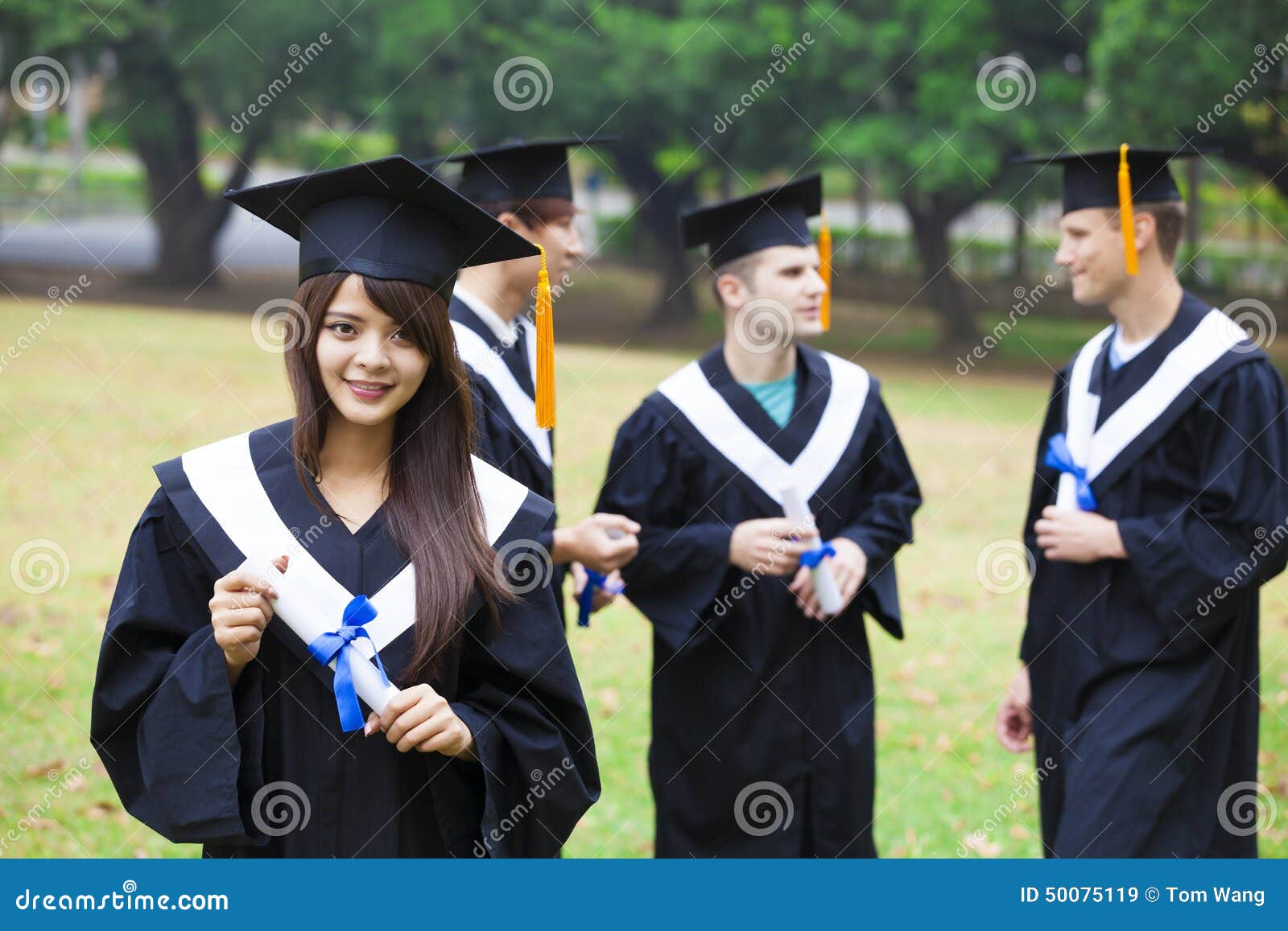 Happy Students in Graduation Gowns Stock Image - Image of academic ...