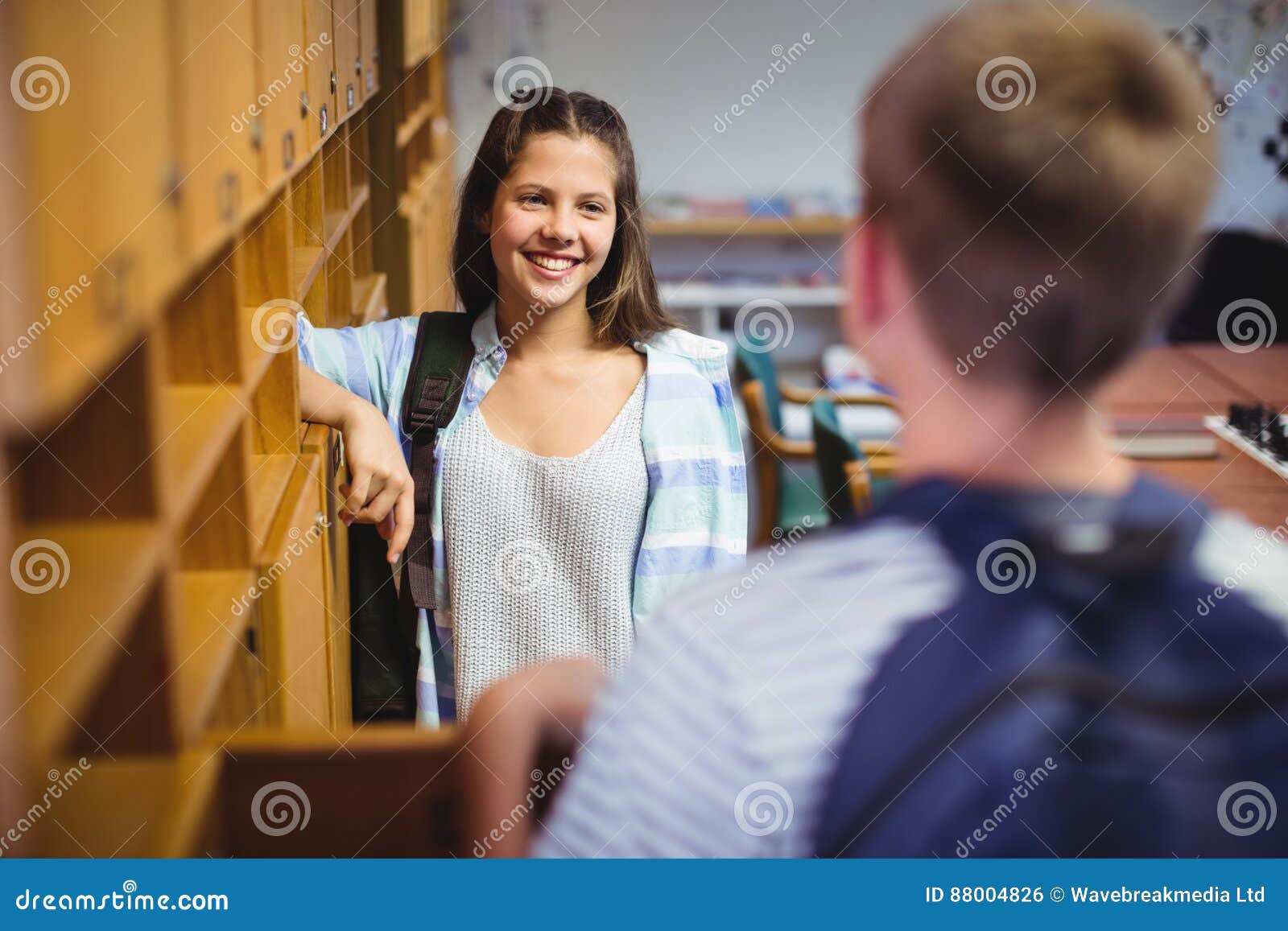 Happy Students Interacting with Each Other in Locker Room Stock Photo ...