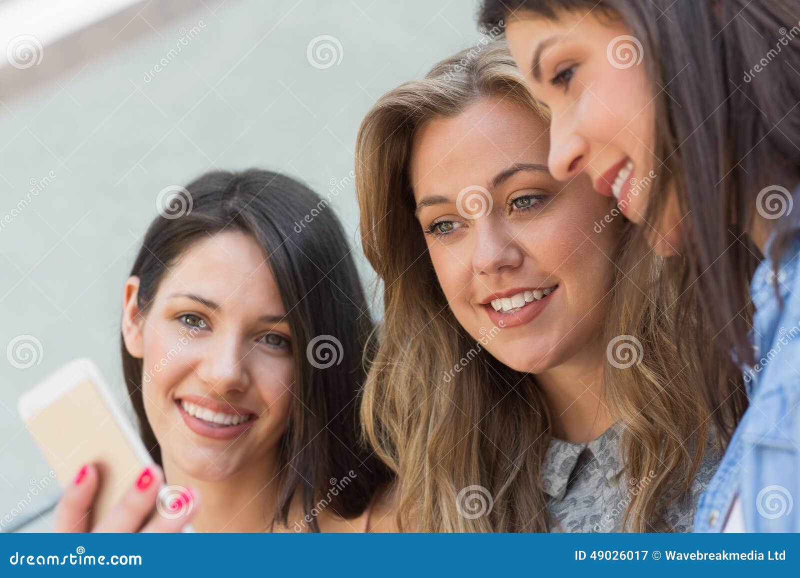 Happy Students Looking at Smartphone Outside on Campus Stock Image ...