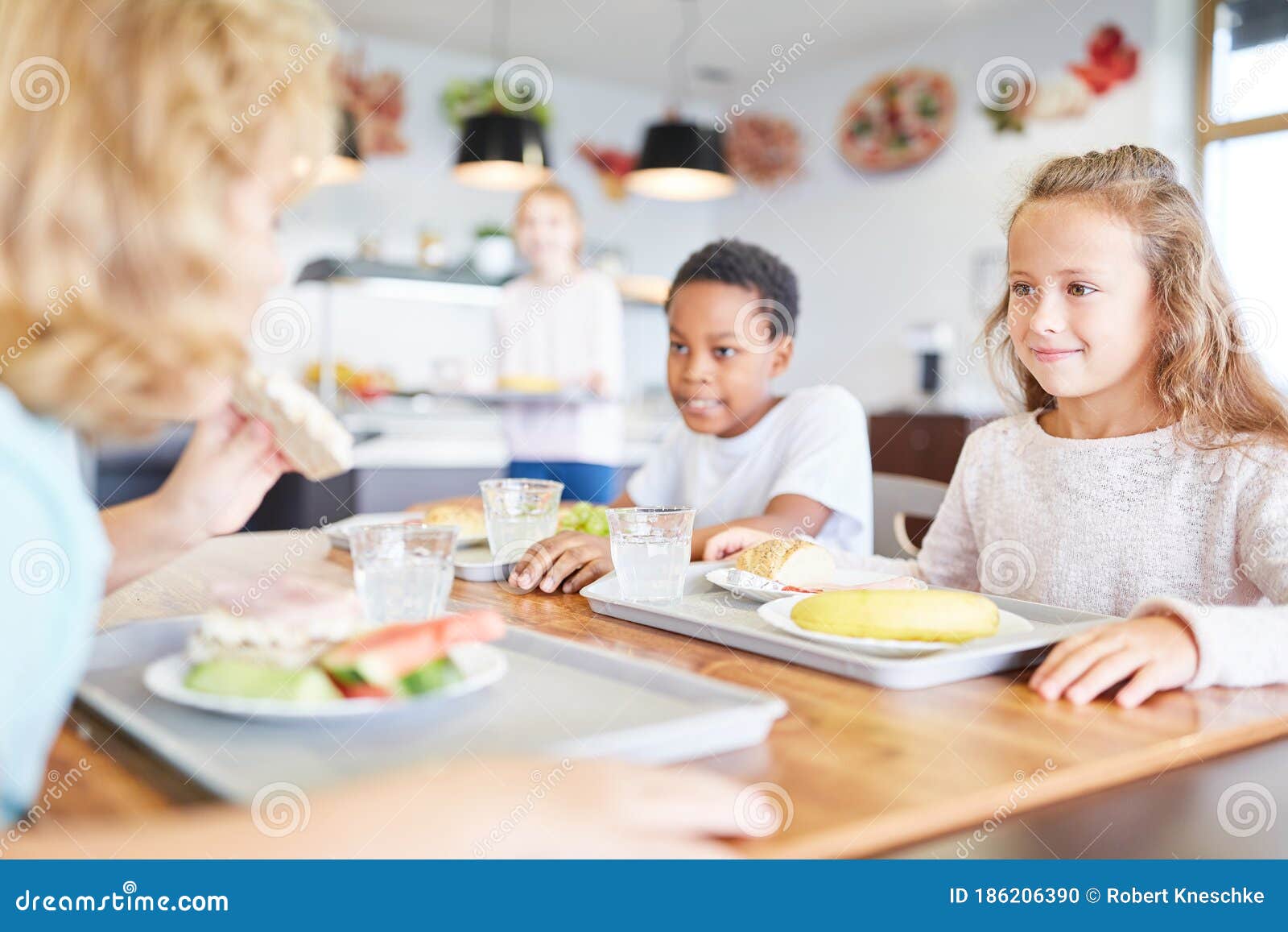 Happy students at lunch stock photo. Image of elementary - 186206390
