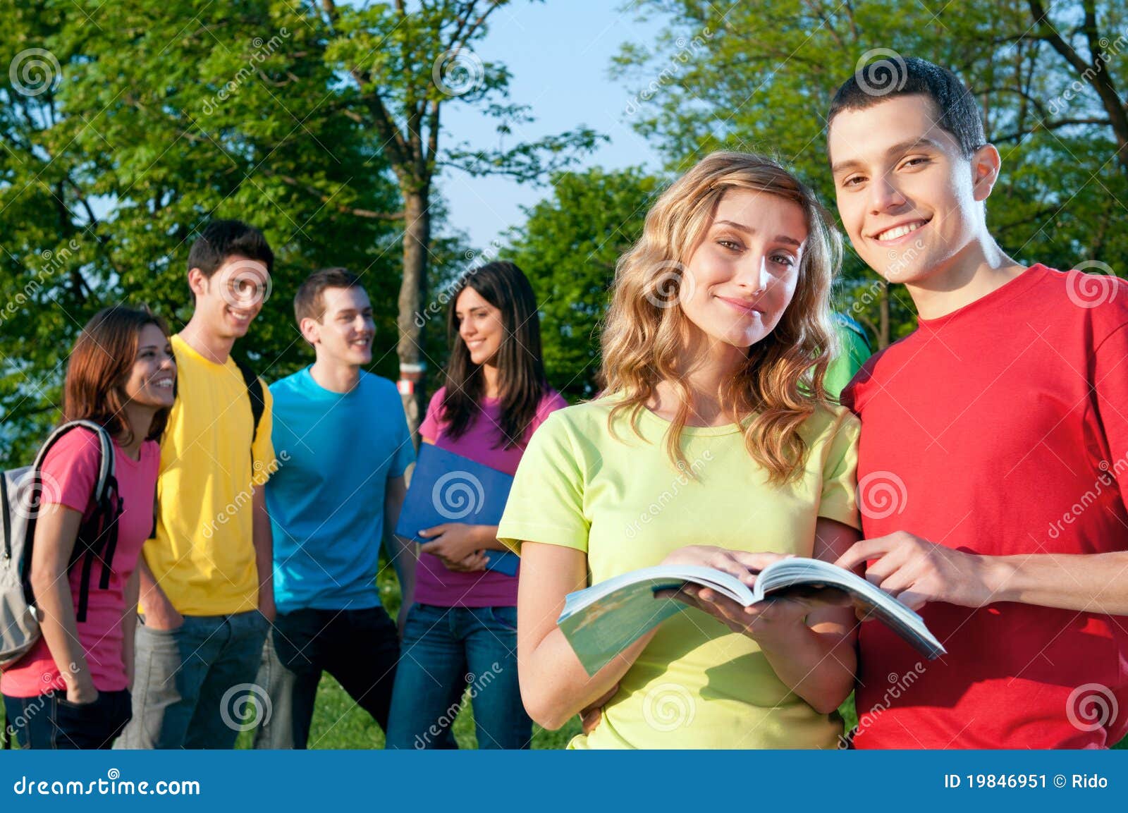 Happy students outdoor stock image. Image of looking - 19846951