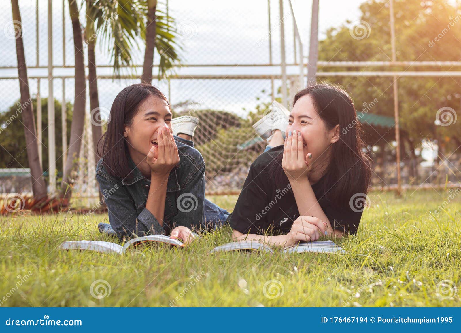 Happy Students is Reading Book on Lawn Stock Photo - Image of lawn ...