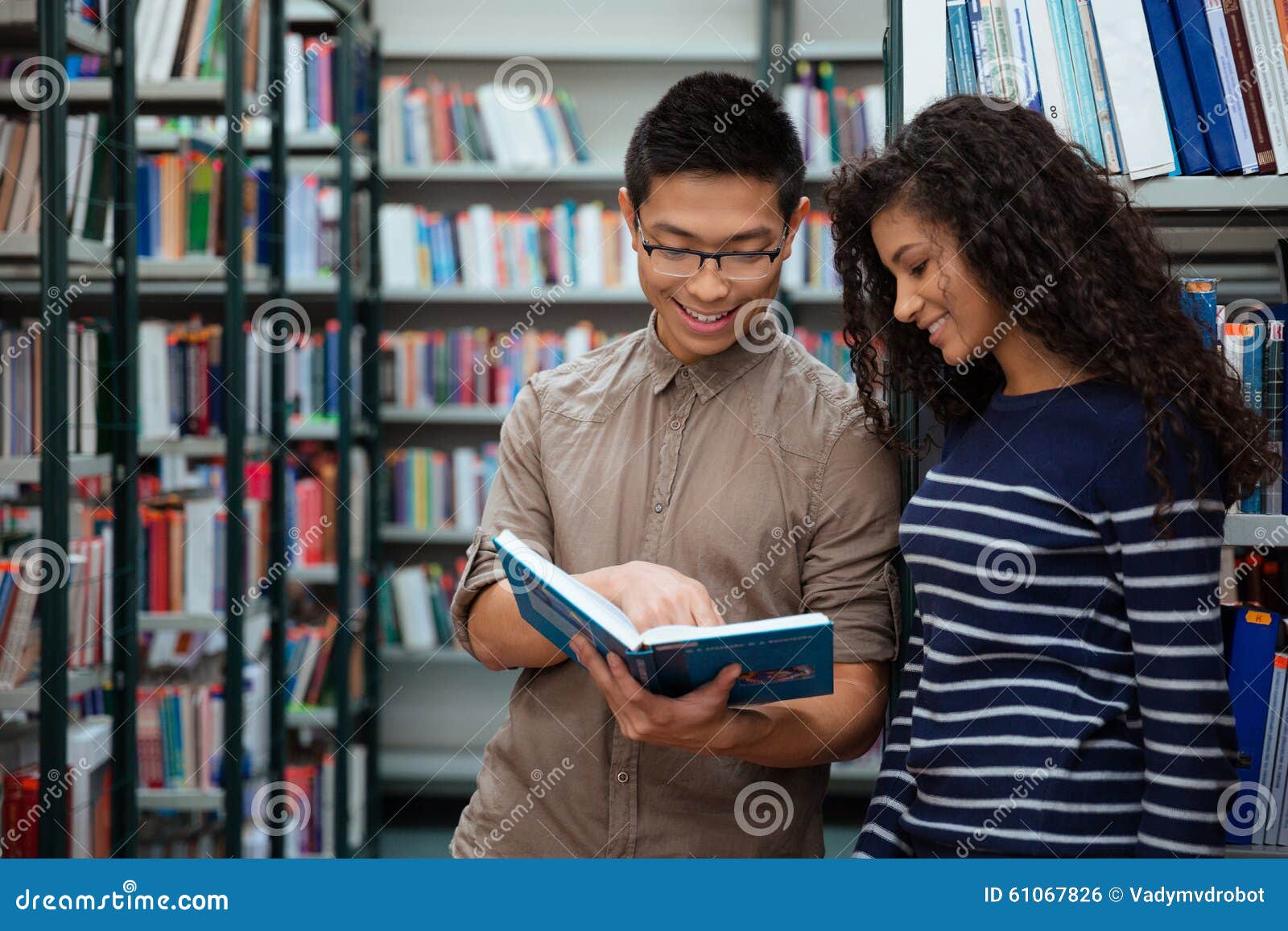 Happy Students Searching Book in Library Stock Photo - Image of ...