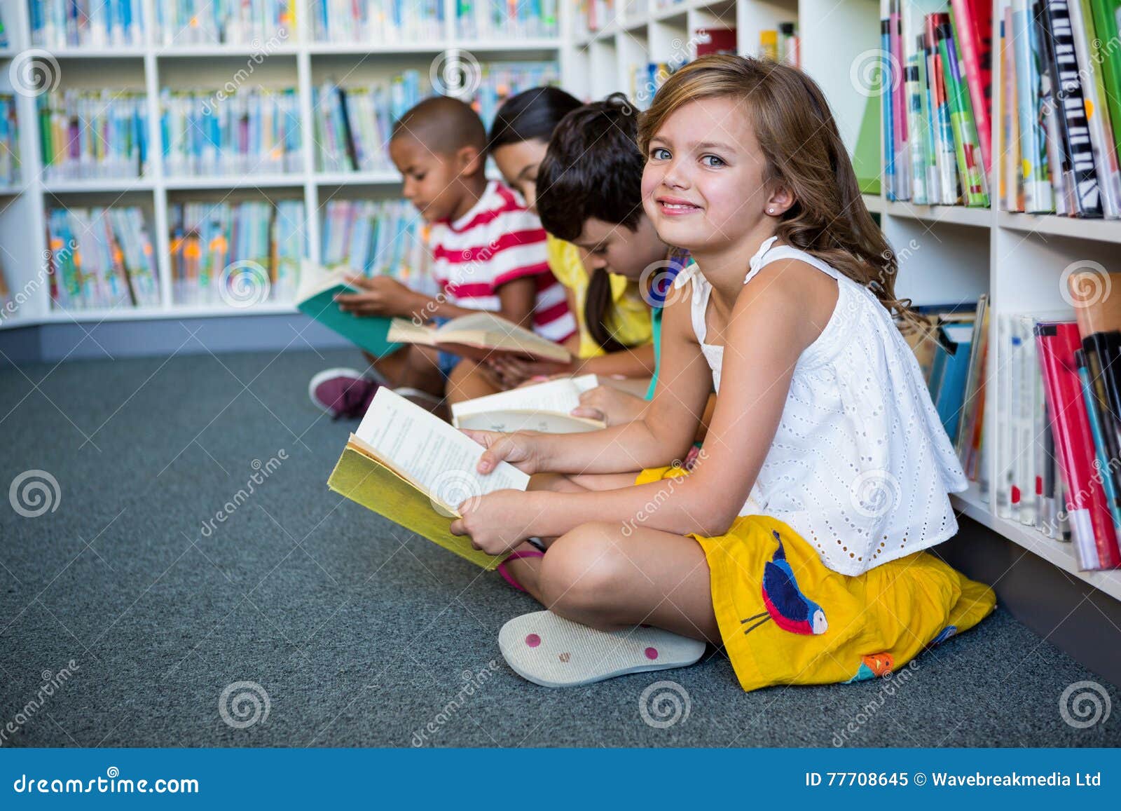 Happy Students Sitting at Library in School Stock Image - Image of ...