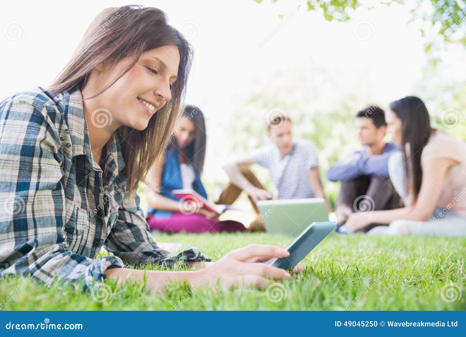 Happy Students Sitting Outside on Campus Stock Photo - Image of female ...