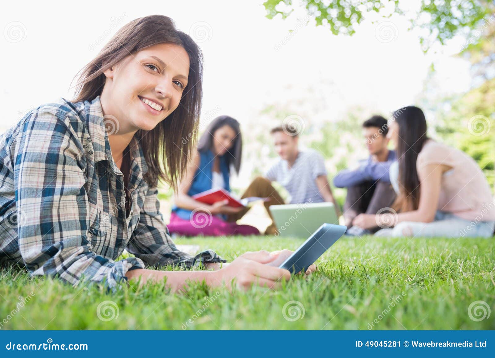 Happy Students Sitting Outside on Campus Stock Image - Image of angle ...