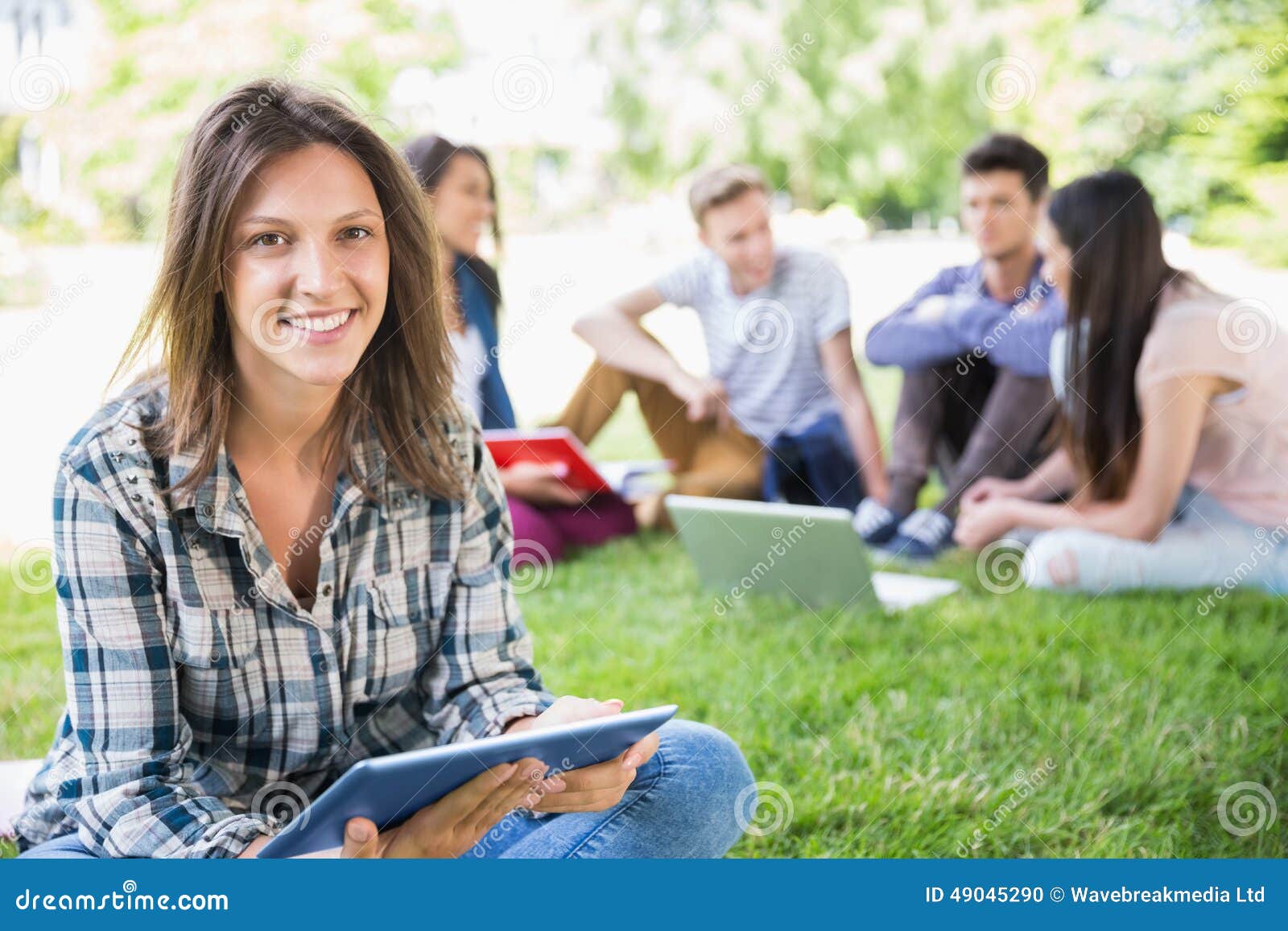 Happy Students Sitting Outside on Campus Stock Photo - Image of female ...