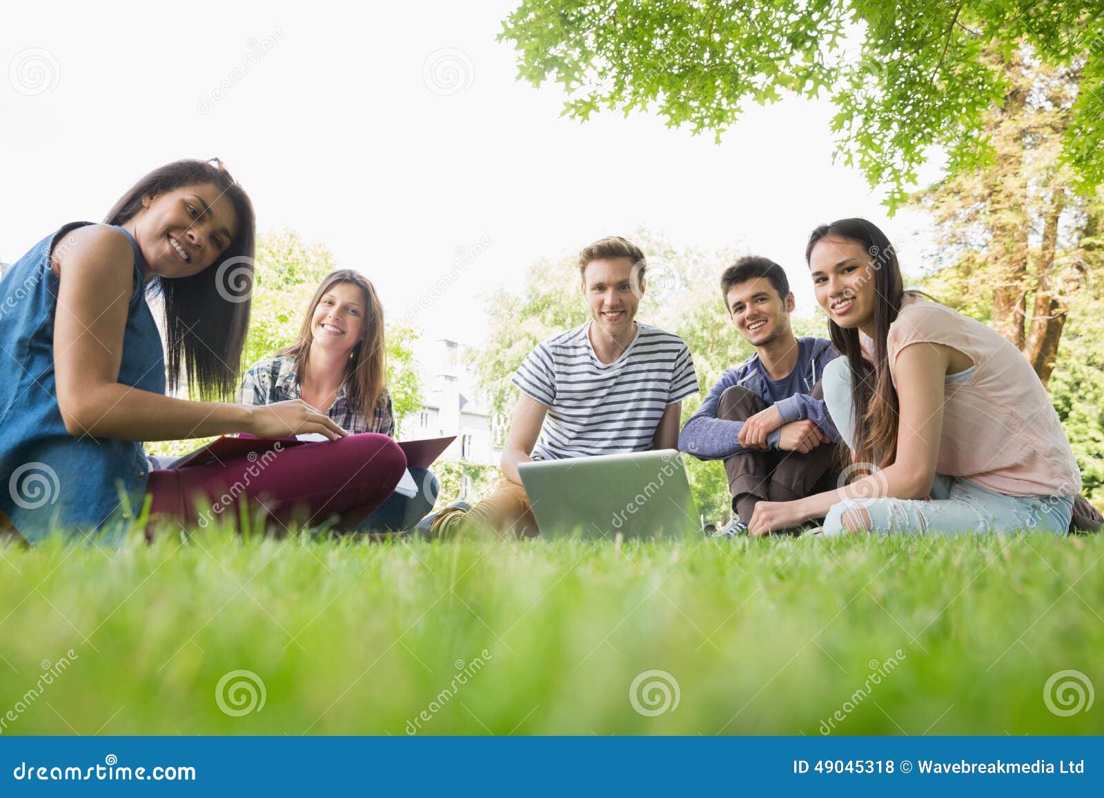 Happy Students Sitting Outside on Campus Stock Photo - Image of student ...