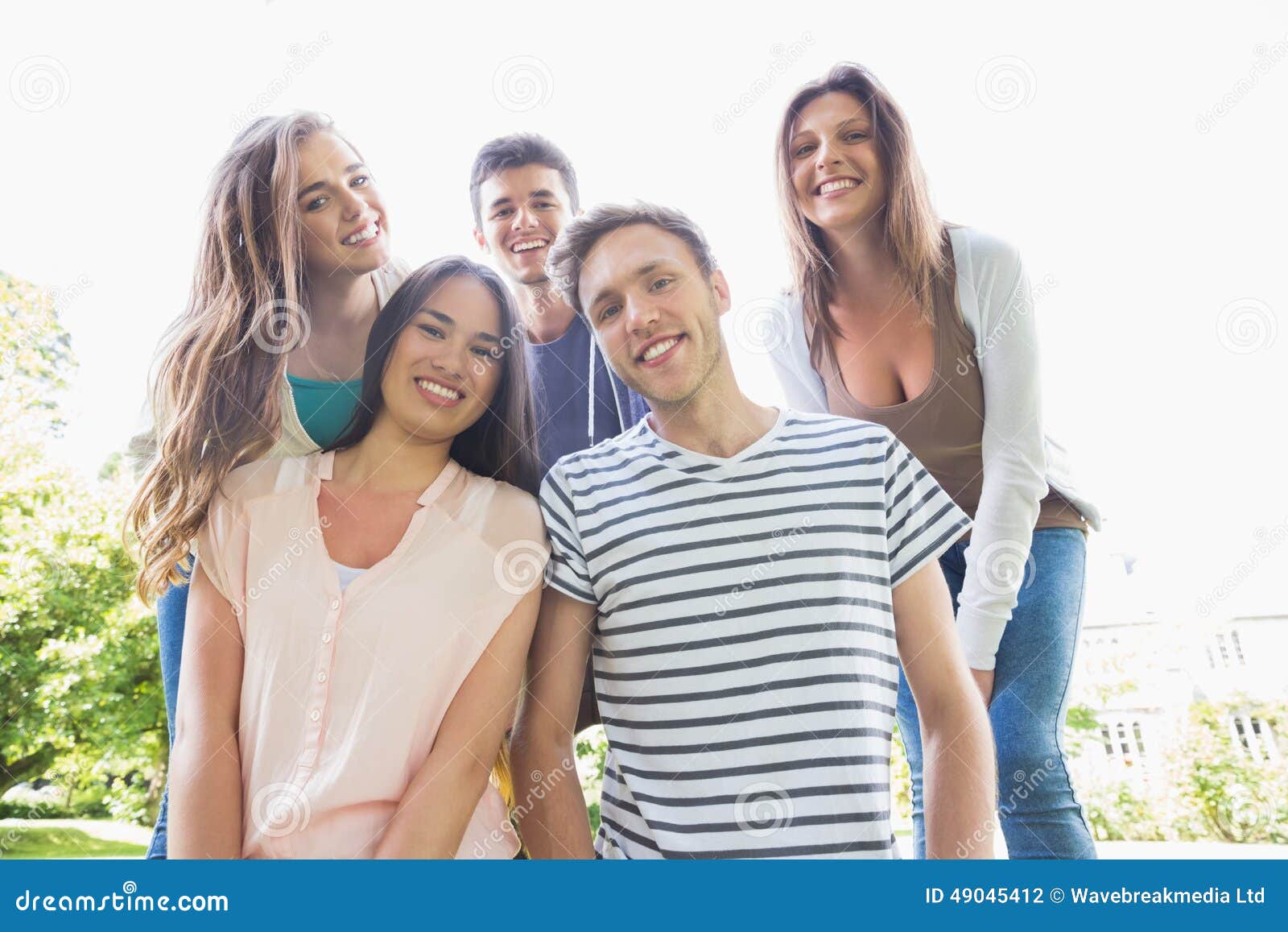 Happy Students Smiling at Camera Outside on Campus Stock Photo - Image ...