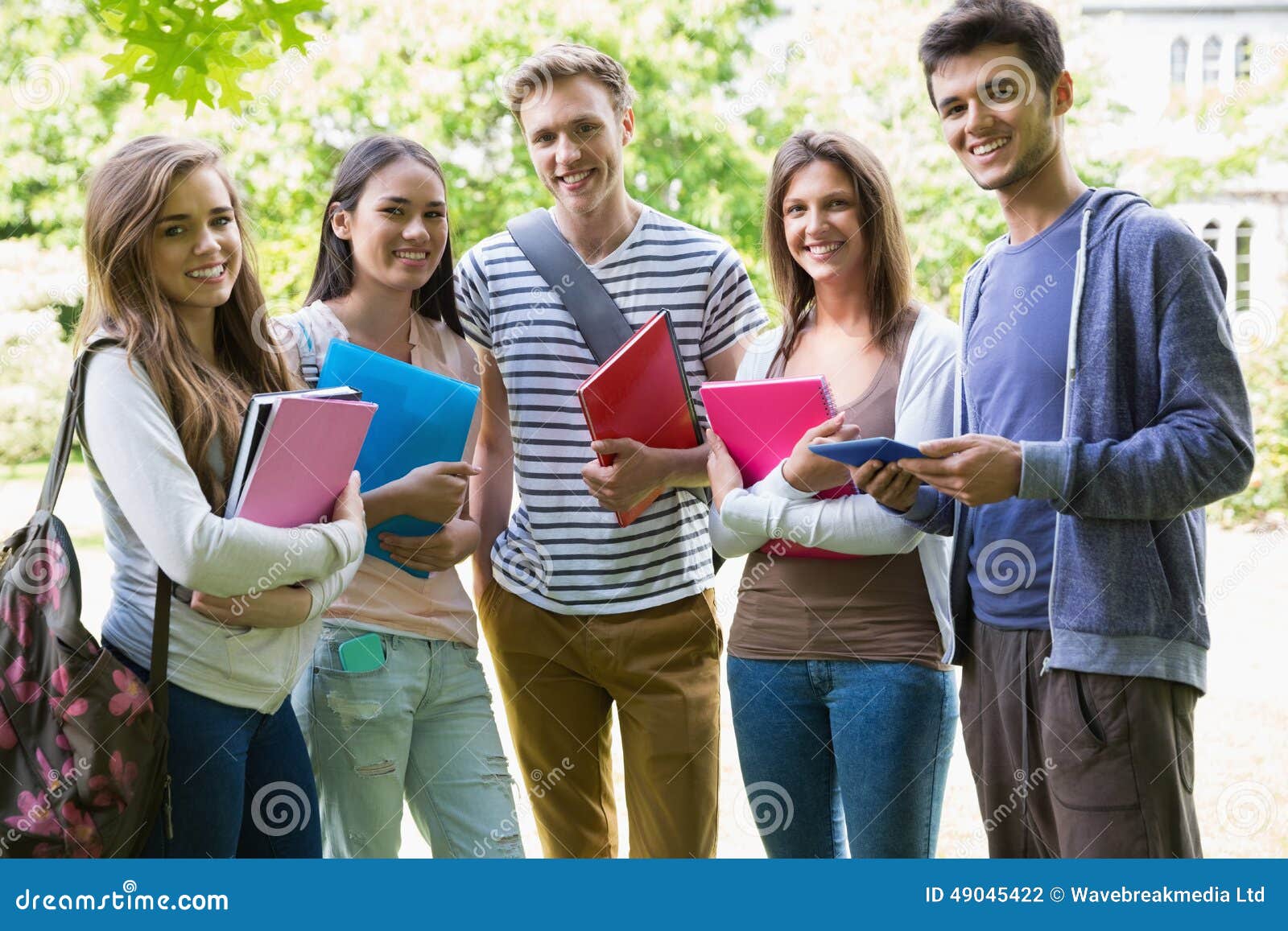Happy Students Smiling at Camera Outside on Campus Stock Photo - Image ...