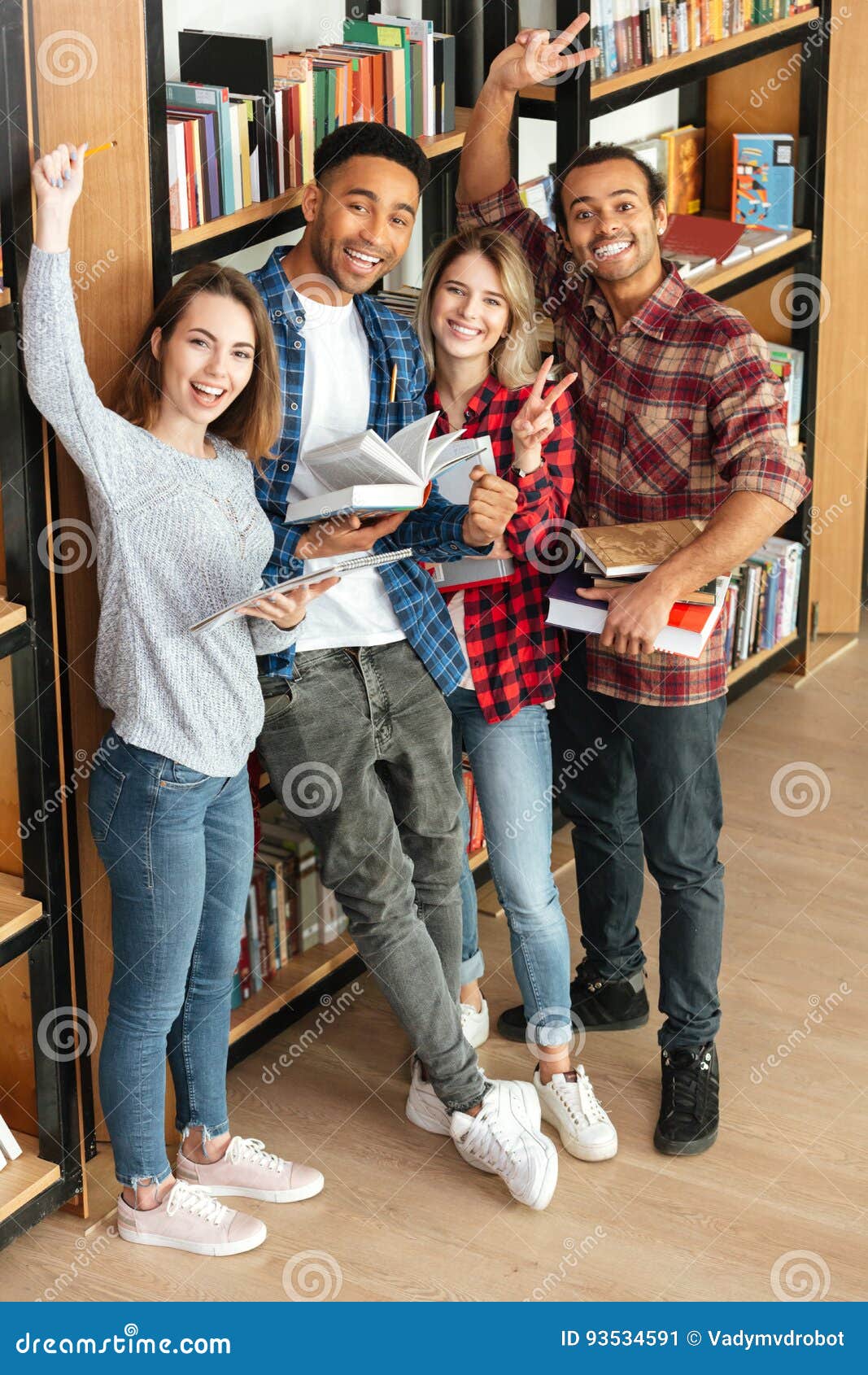Happy Students Standing in Library Reading Book Stock Image - Image of ...