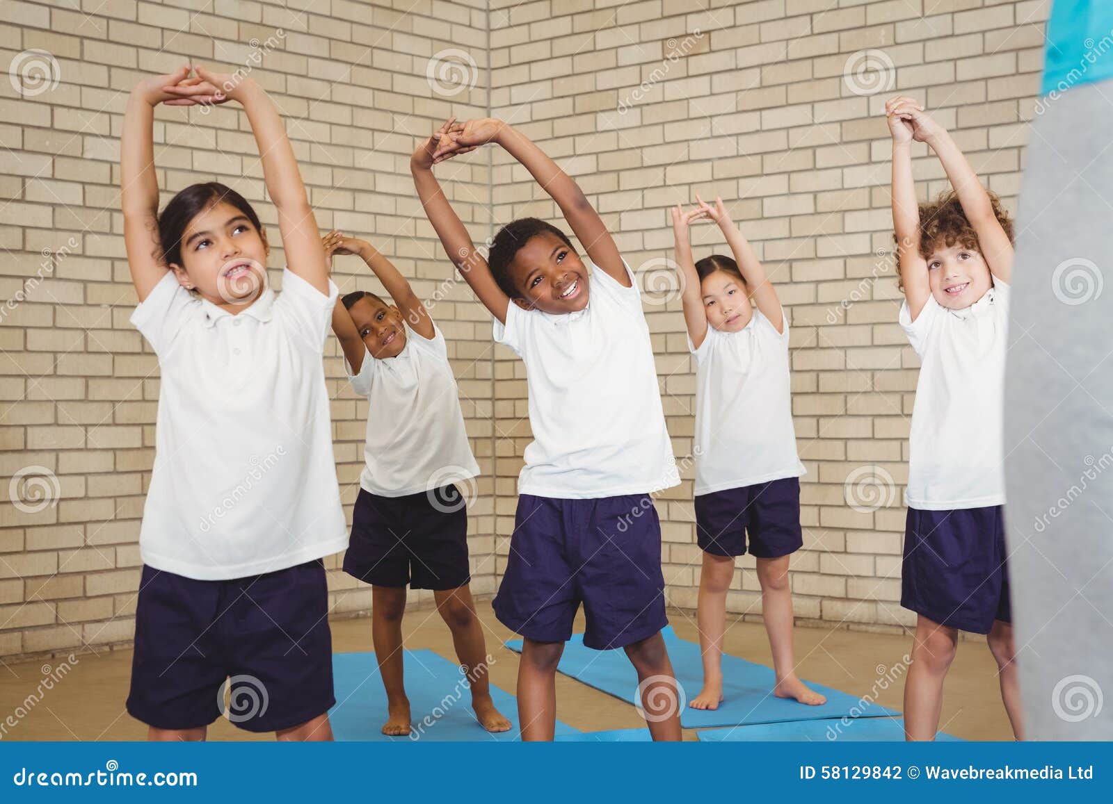 Happy Students Stretching Out Together Stock Photo - Image of ...