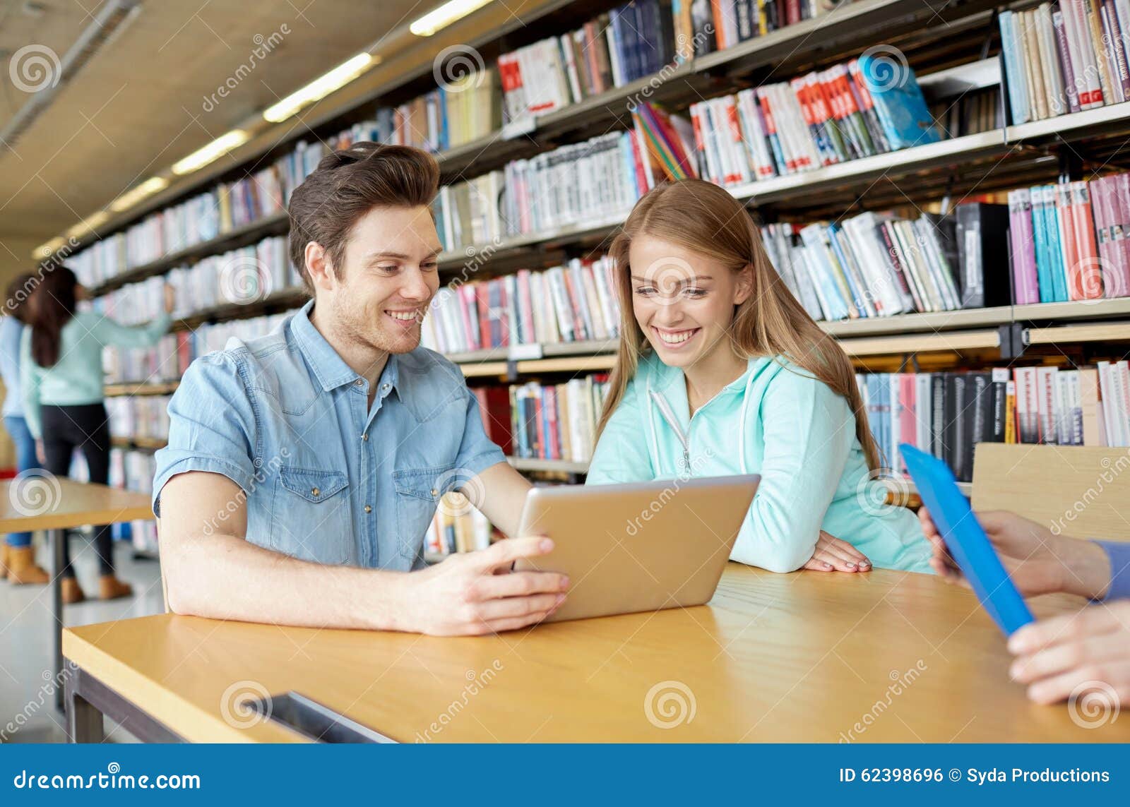 Happy Students with Tablet Pc in Library Stock Photo - Image of concept ...