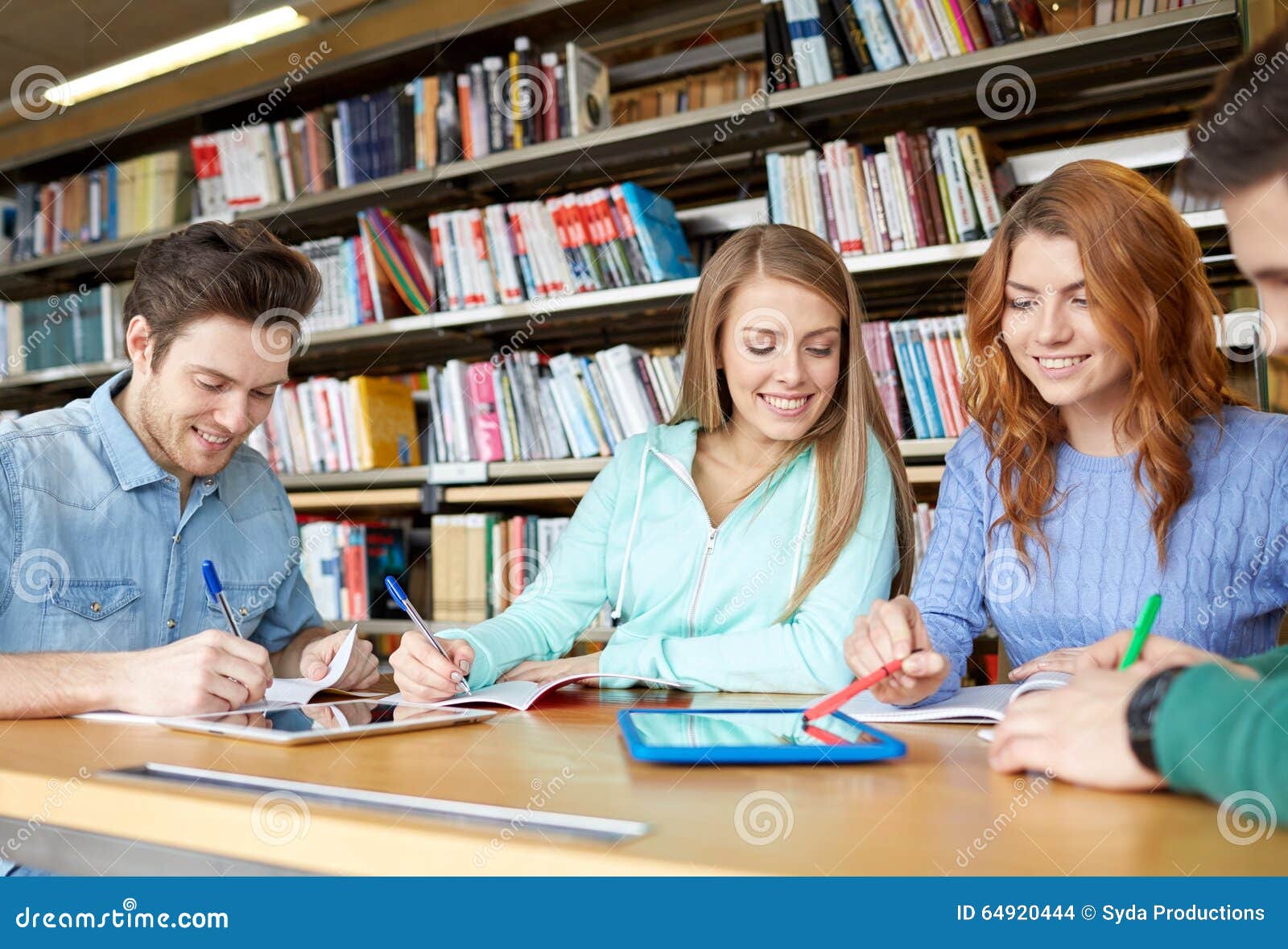 Happy Students with Tablet Pc in Library Stock Photo - Image of ...