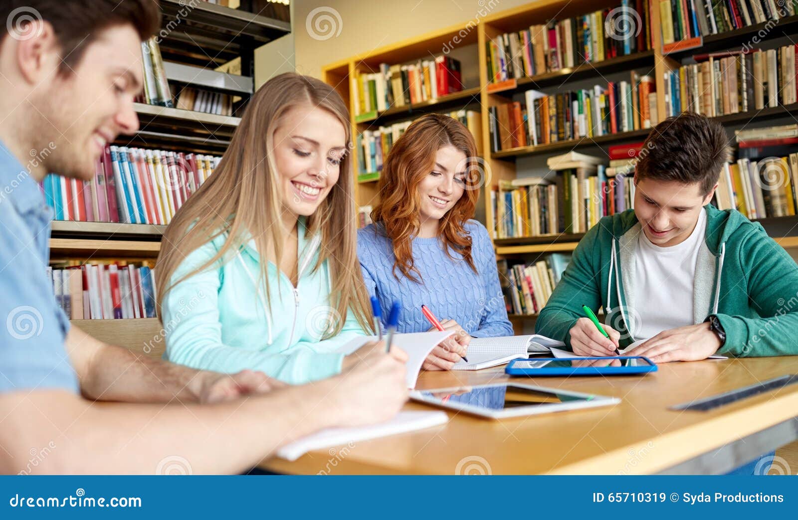 Happy Students with Tablet Pc in Library Stock Image - Image of sitting ...