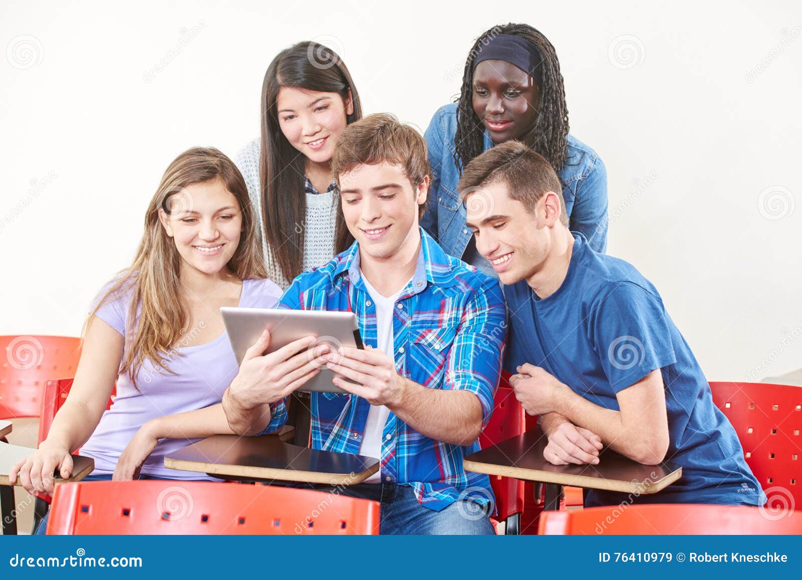 Happy students with tablet stock image. Image of tablet - 76410979