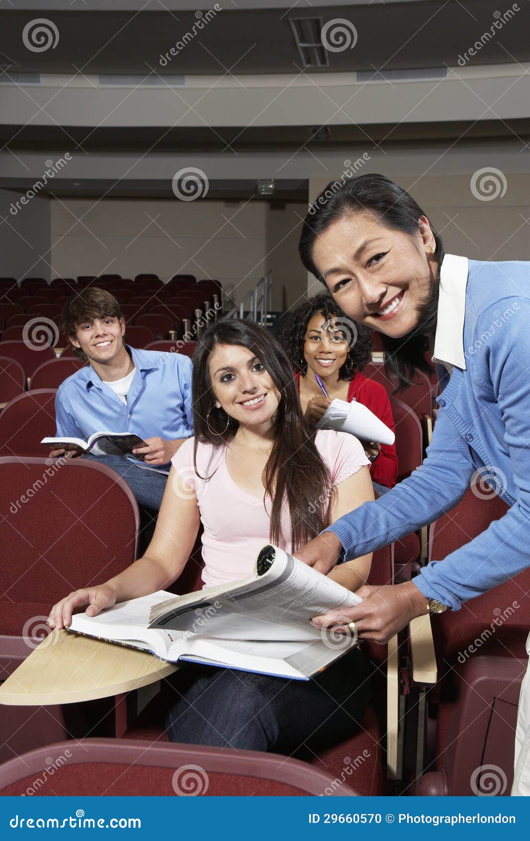 Happy Students with Teacher in Classroom Stock Photo - Image of four ...
