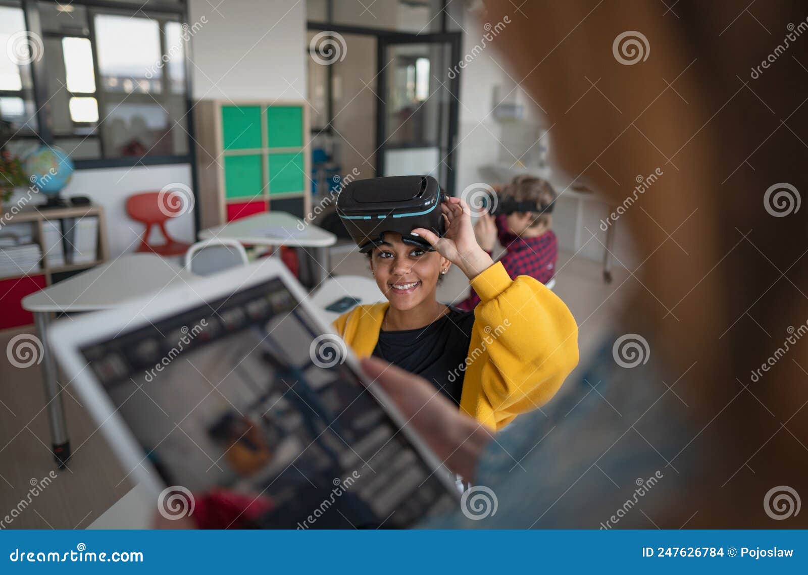 Happy Students Wearing Virtual Reality Goggles at School in Computer ...