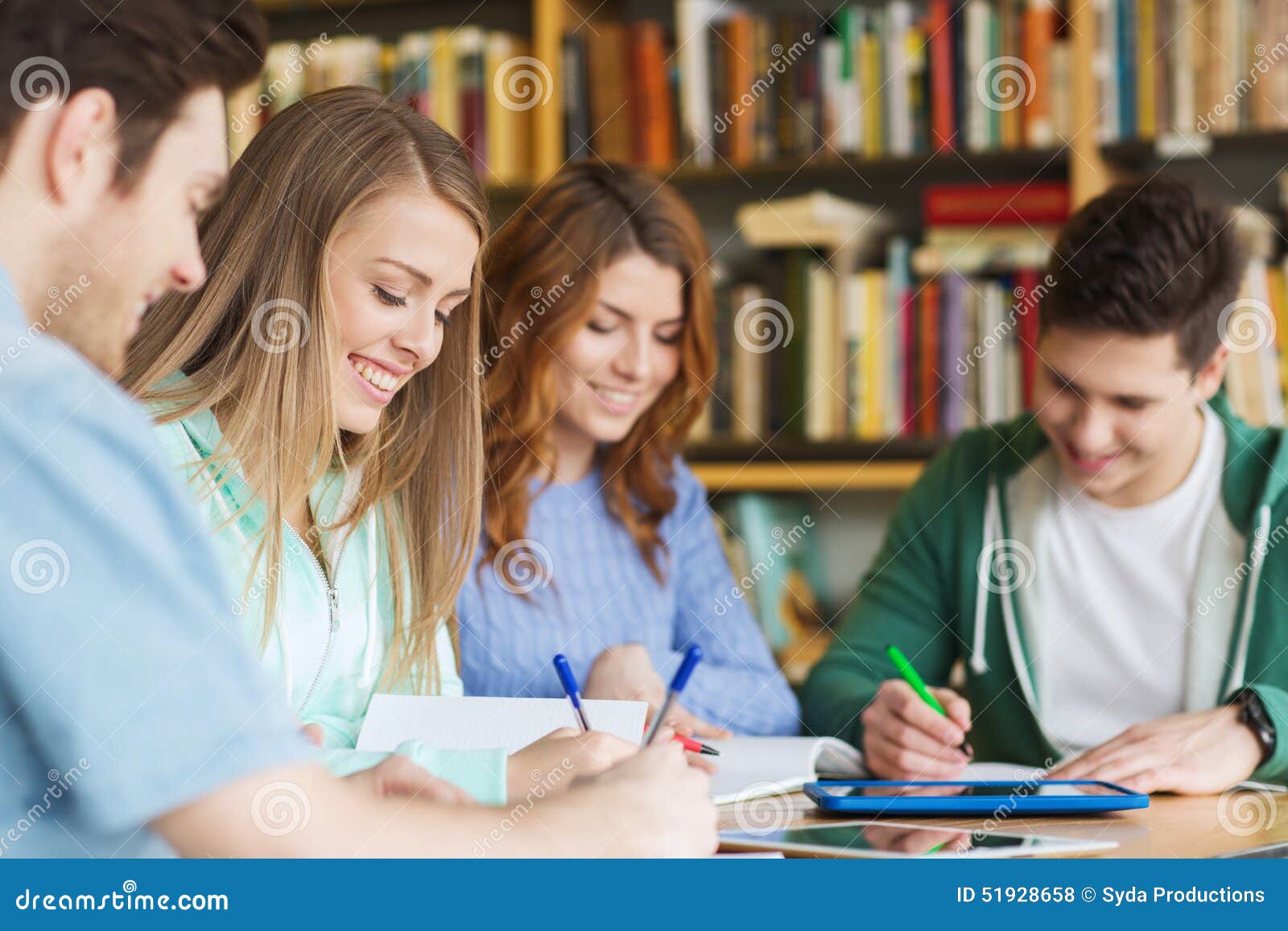 Happy Students Writing To Notebooks in Library Stock Photo - Image of ...