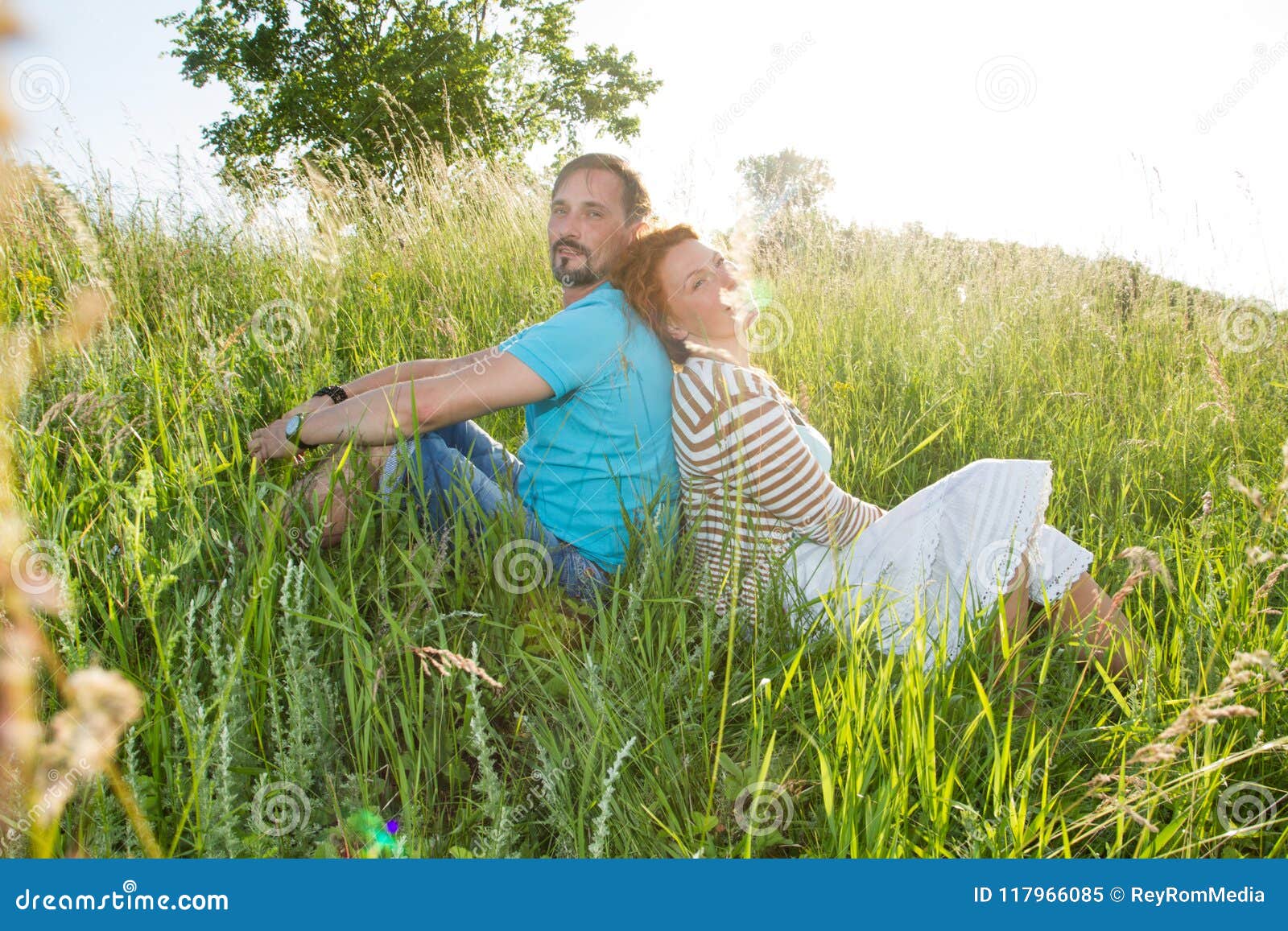 Happy Attractive Couple Sitting Together At Outdoors Picnic Couple On