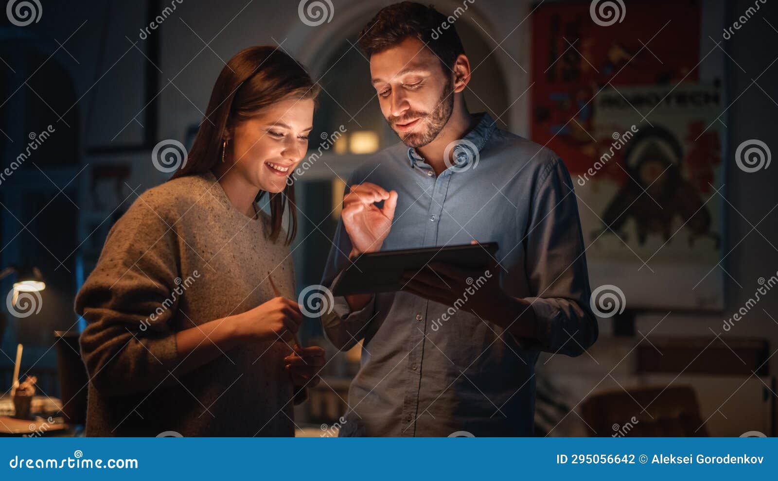 Happy and Successful Employees Discussing Work-Related Projects on a ...